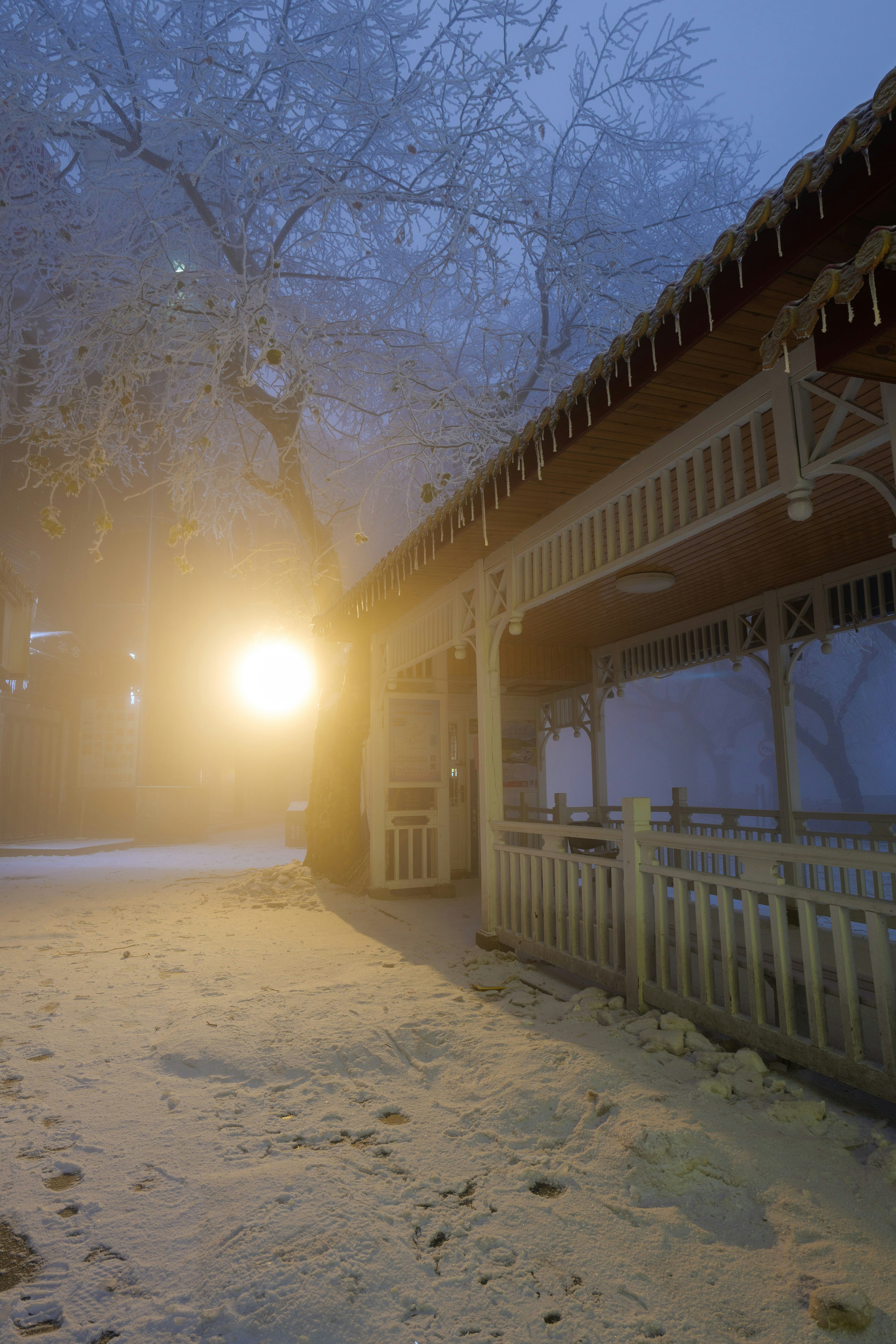 Warm Lantern in a Snowbound Gazebo