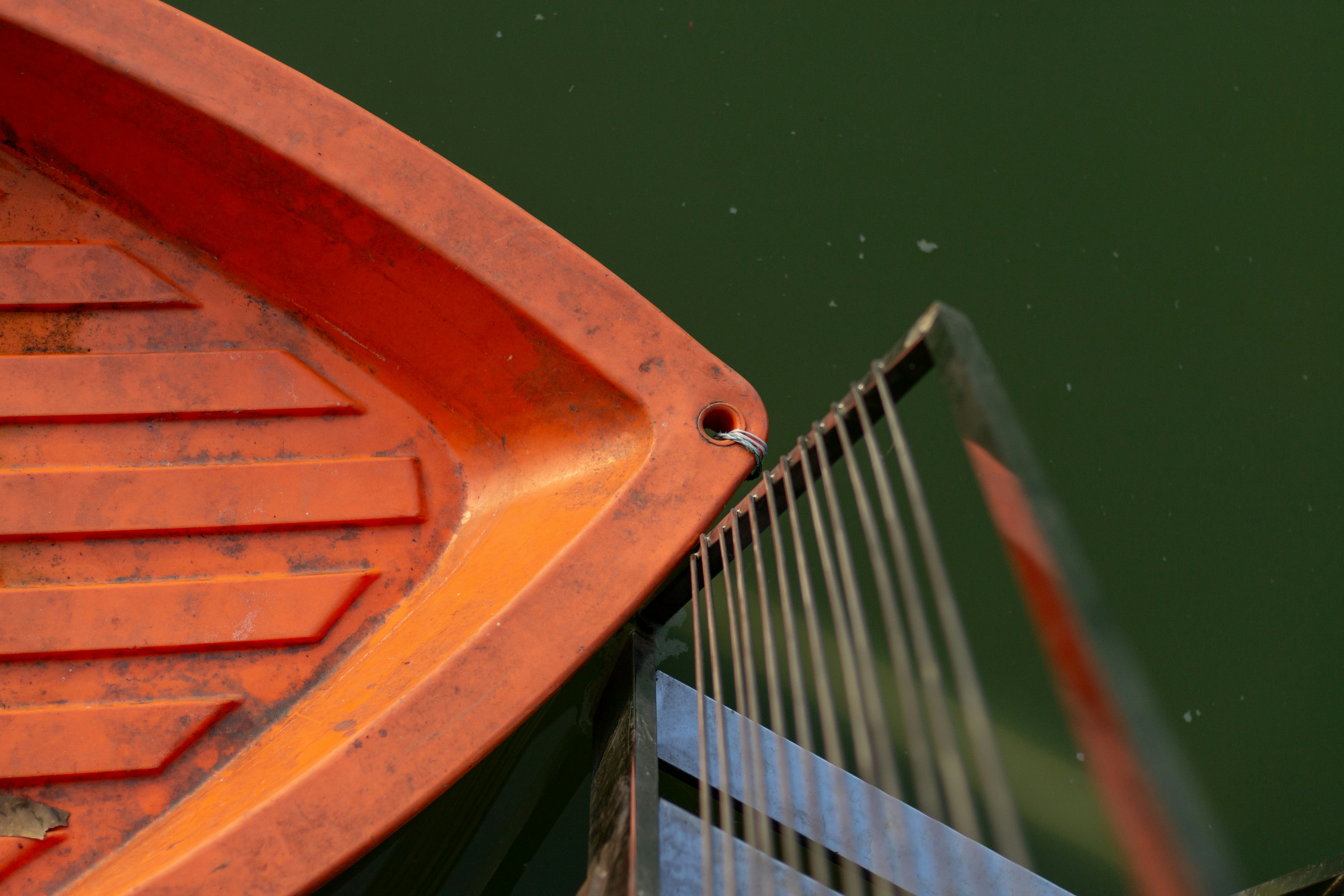Rustic Red Wheel and Guitar Strings: A Close-Up of Industrial Color and Texture