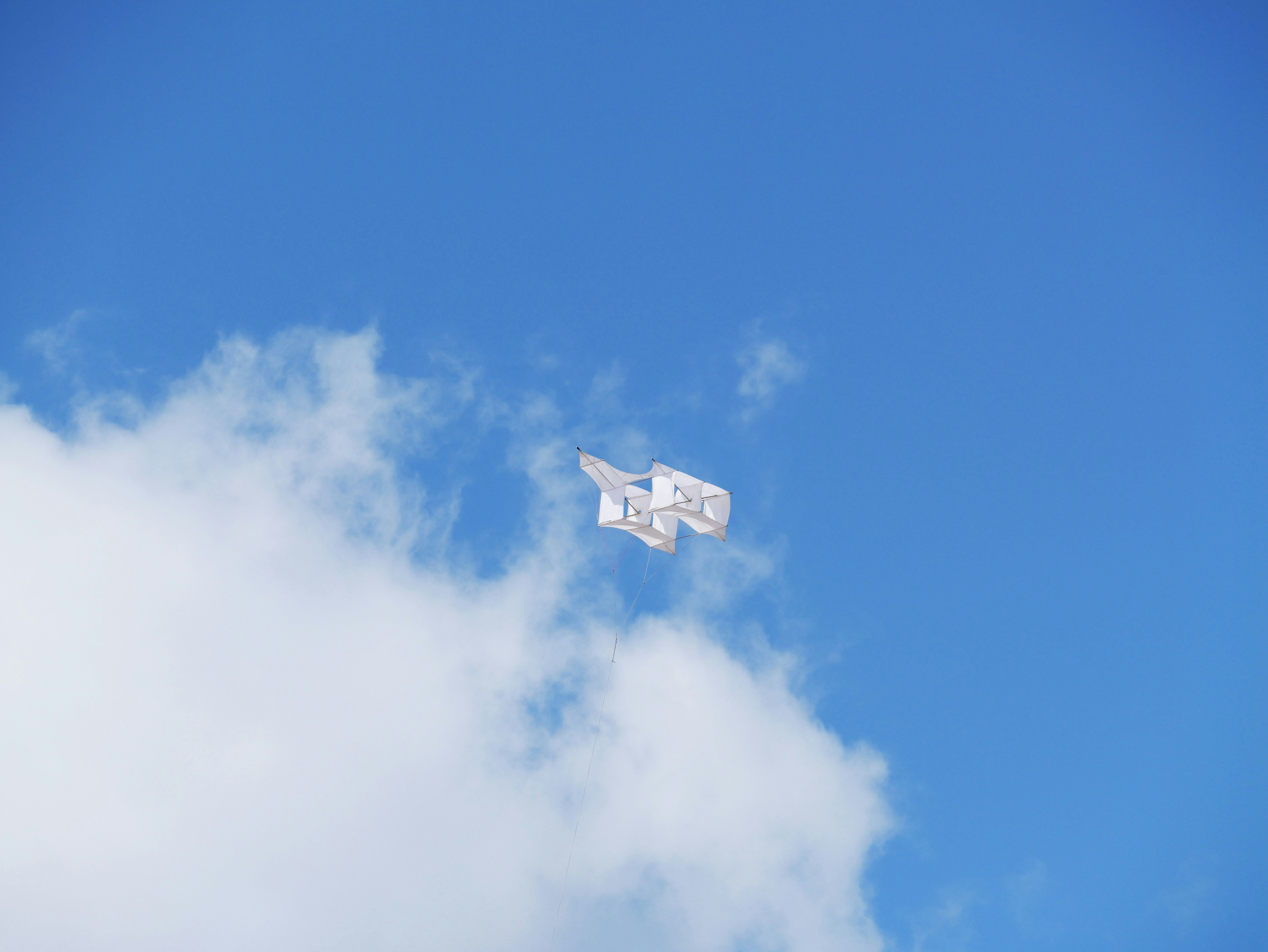 Fragment of a Sky-High Banner Drifting Among Quiet Clouds