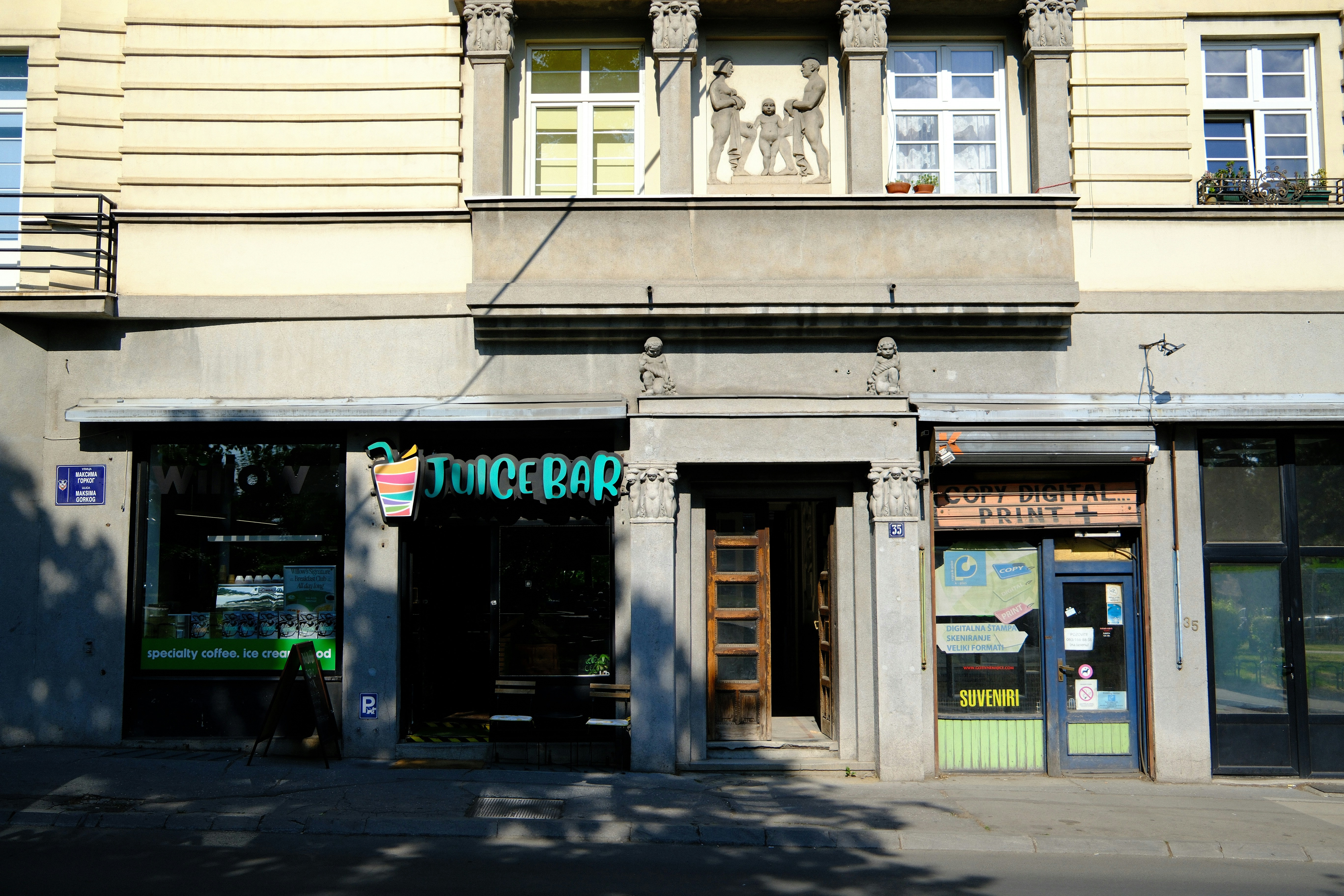 Juice Bar Frontage: A Row of Shops Under a Classic Facade