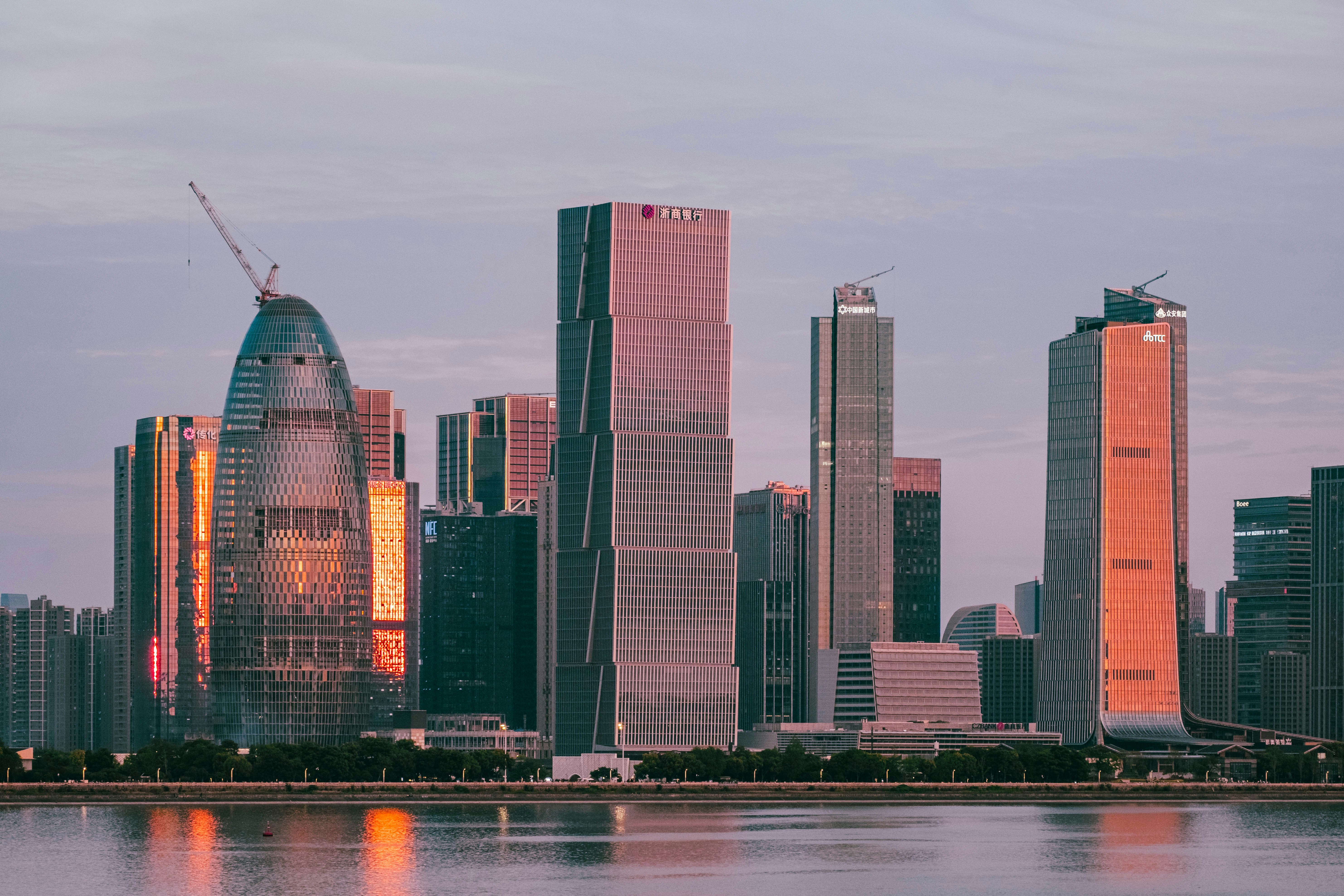 Sunlit Skyline: Riverside Towers Reflecting a Quiet Dawn