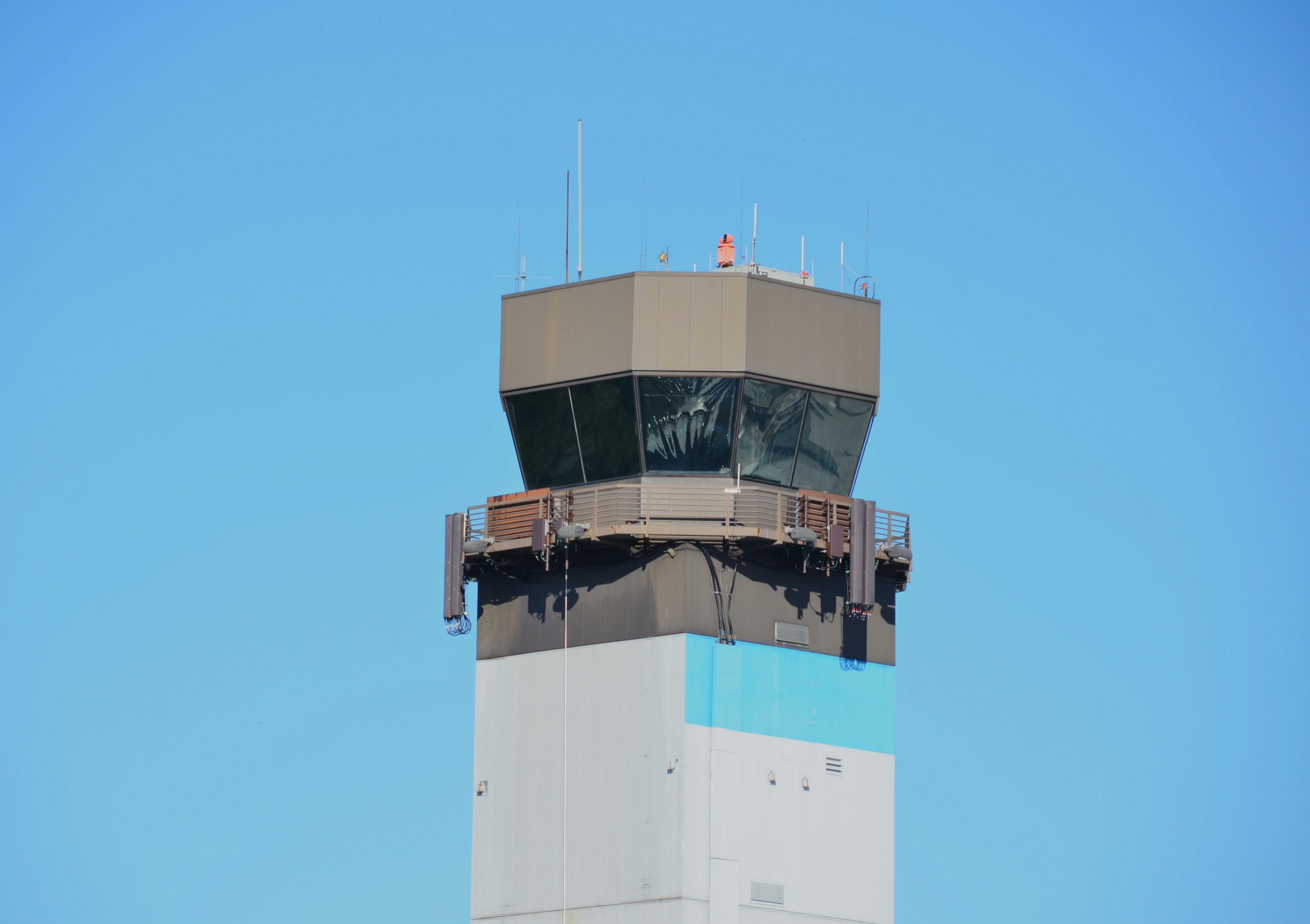 Lone Sentinel: Aerial Control Tower Against a Clear Sky
