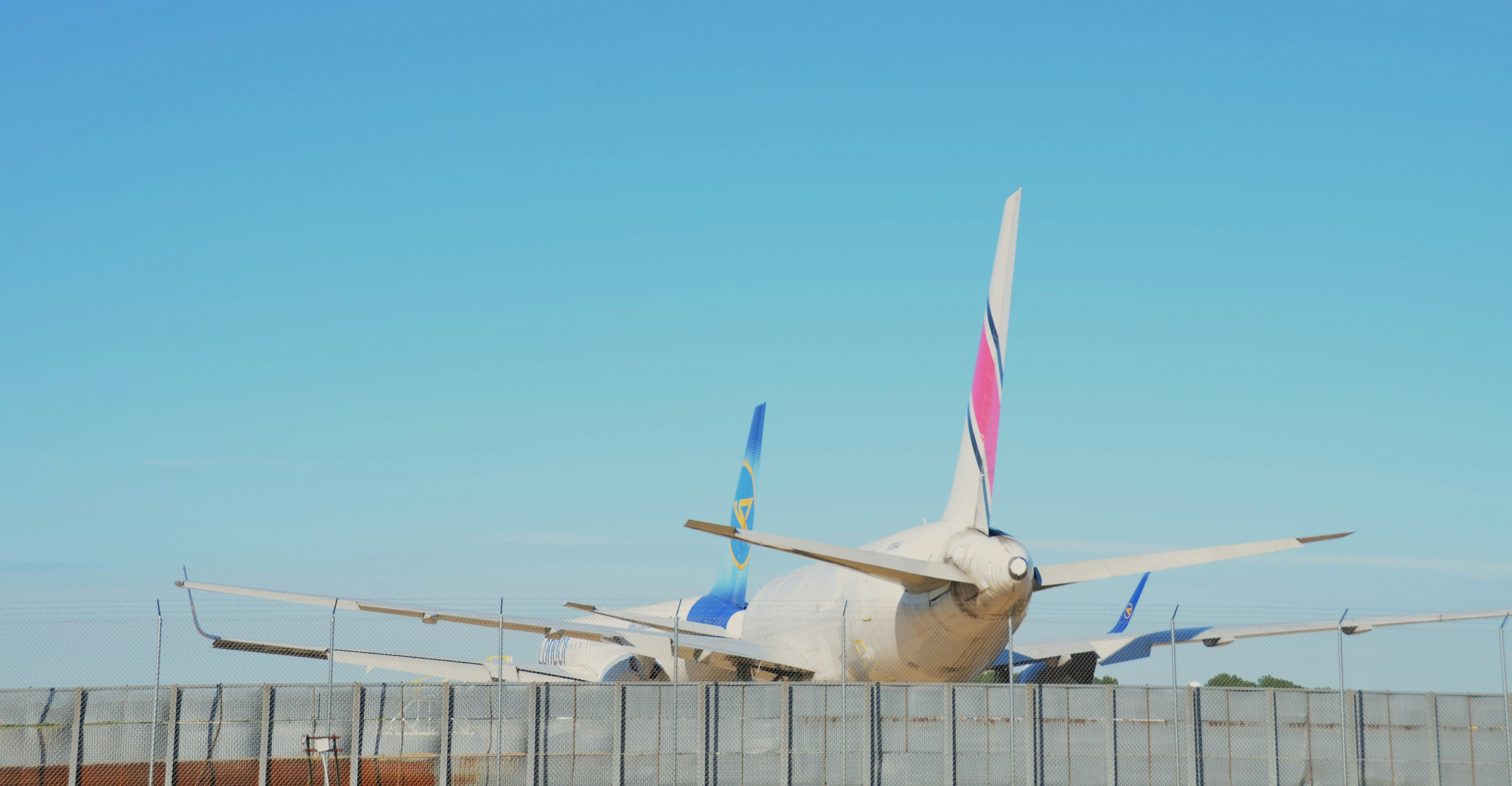 Tail End of Transit: Grounded Jet framed by a clear sky
