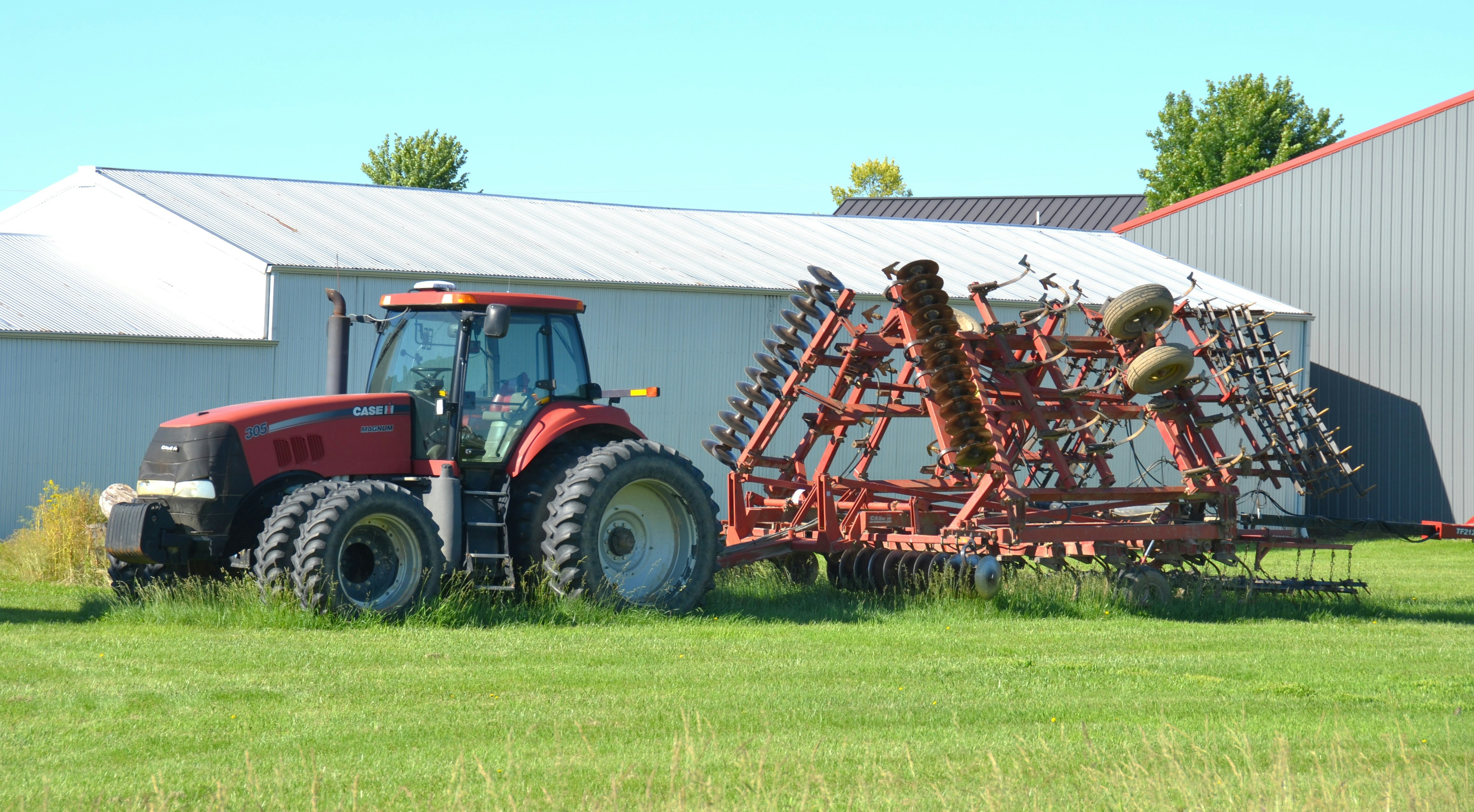 Red Tractor and Towed Sickle-Onfield Machinery