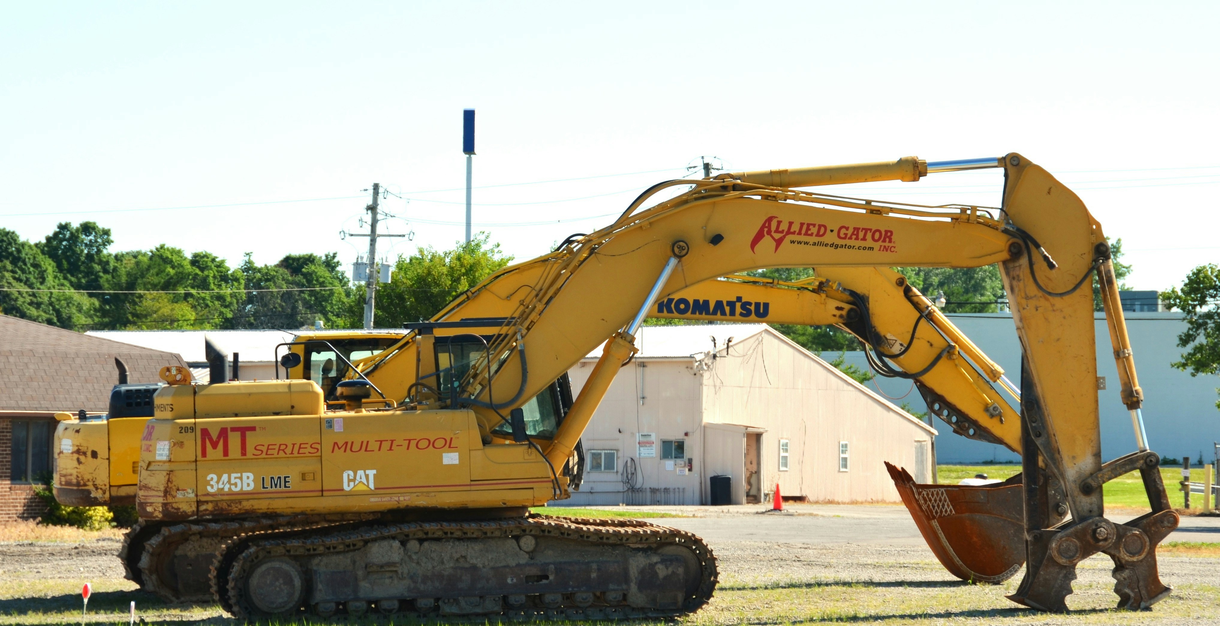 Giant Excavator at Rest in a Quiet Yard