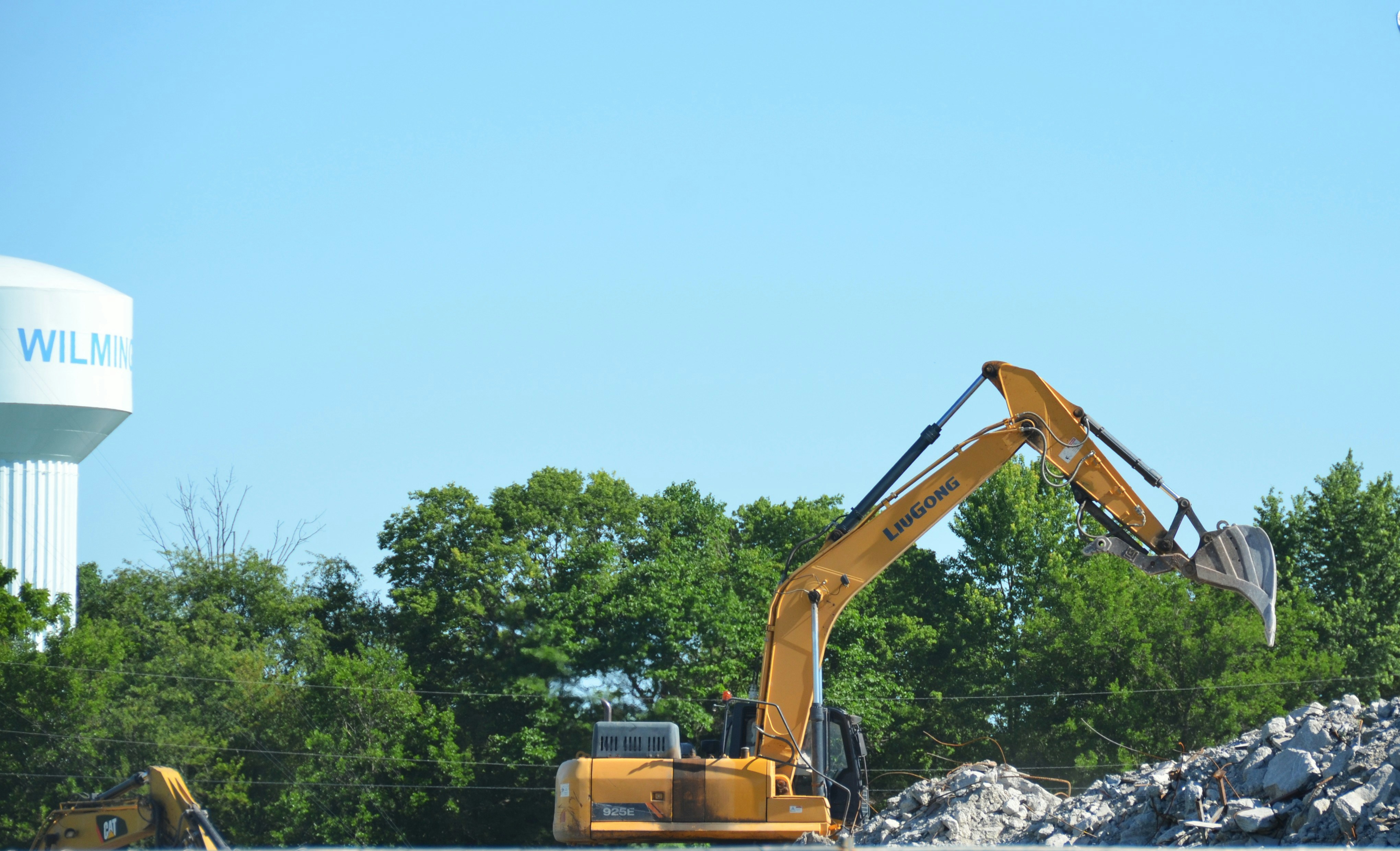 Crane Arc Over Pile: Machinery at Work Under a Clear Sky