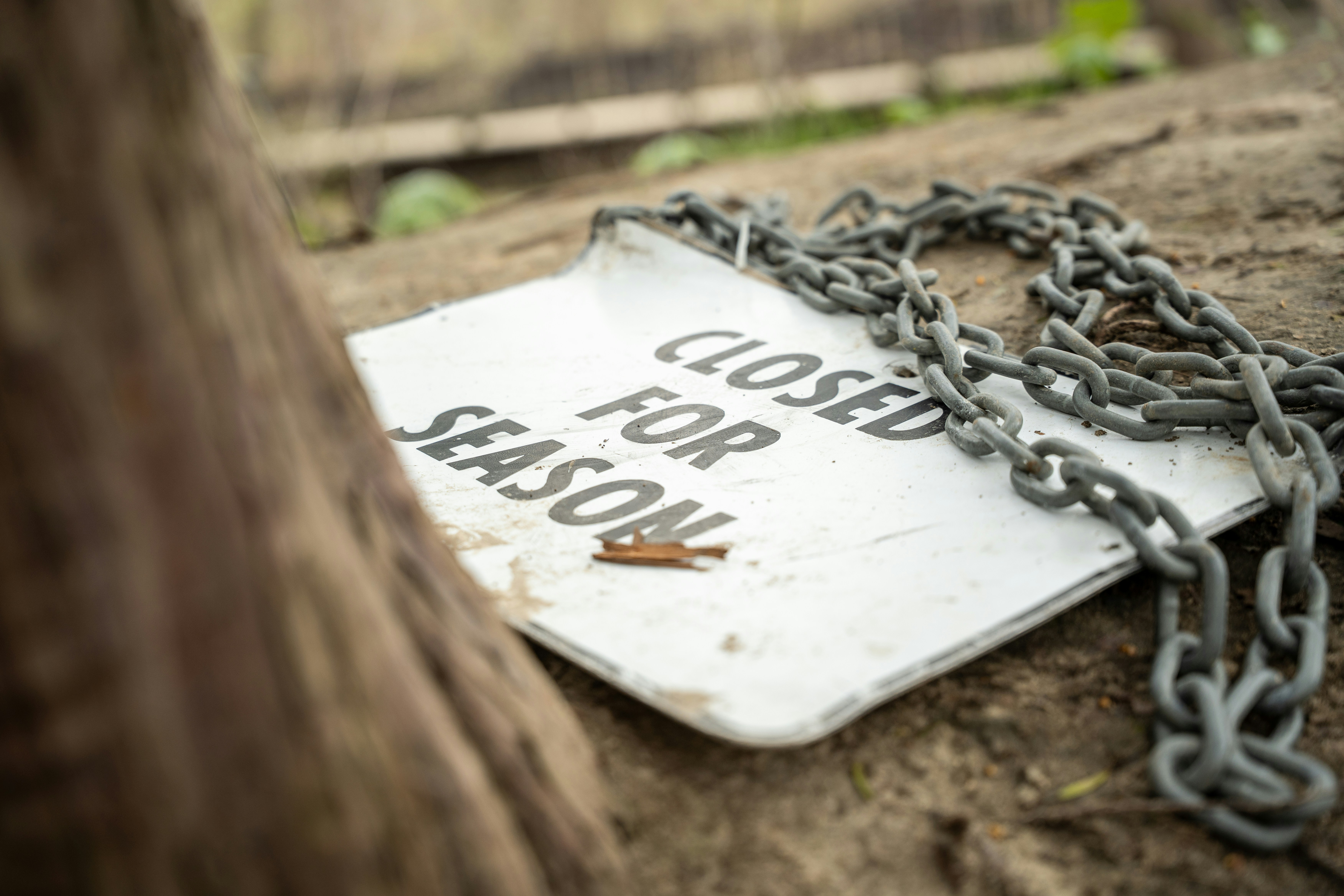 Chain and Closed Gate: A Weathered Seasonal Sign