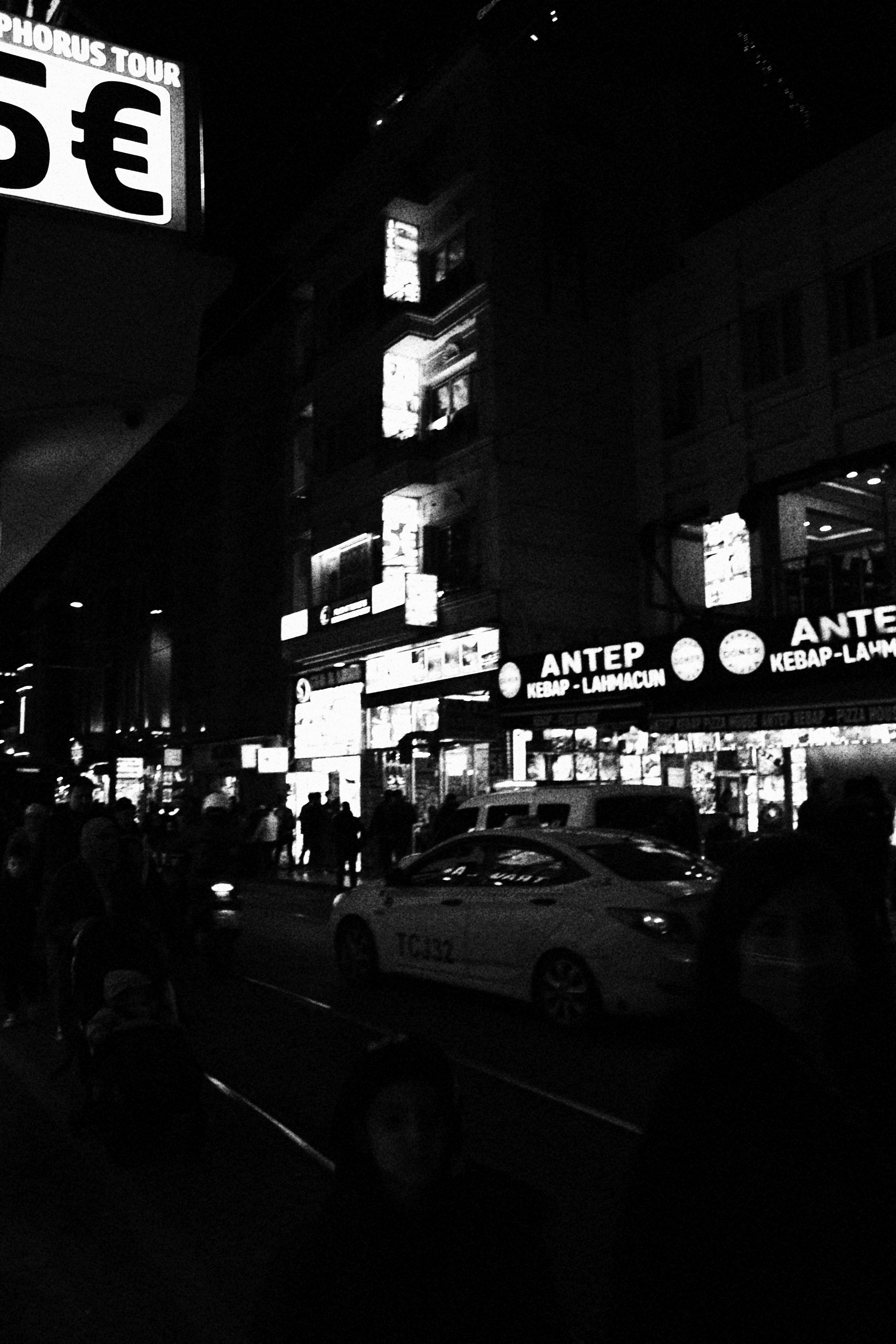 Neon Pulse Over a Crowded City Night