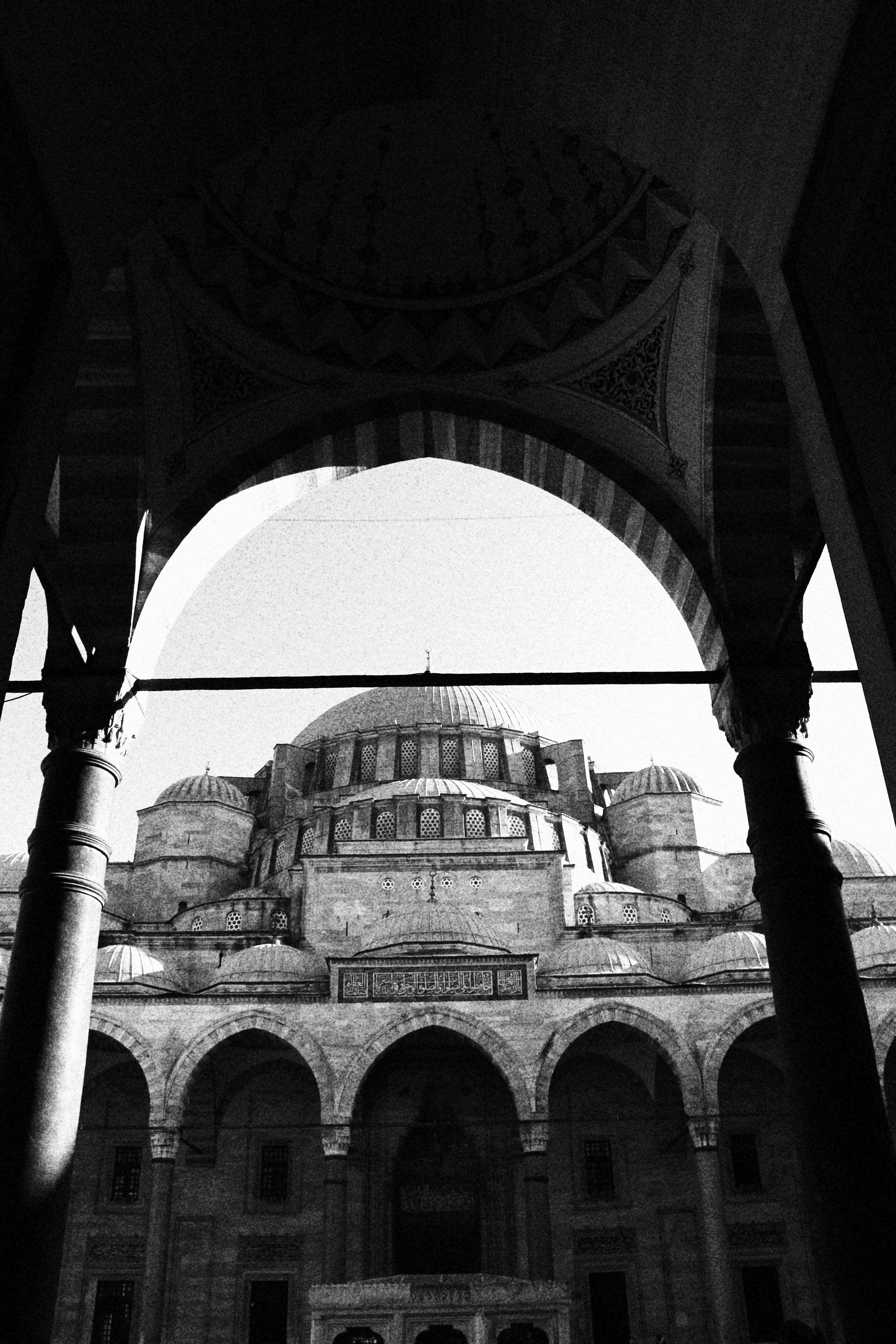 Archways to Byzantium: Dome Framed in Shadowed Courtyard