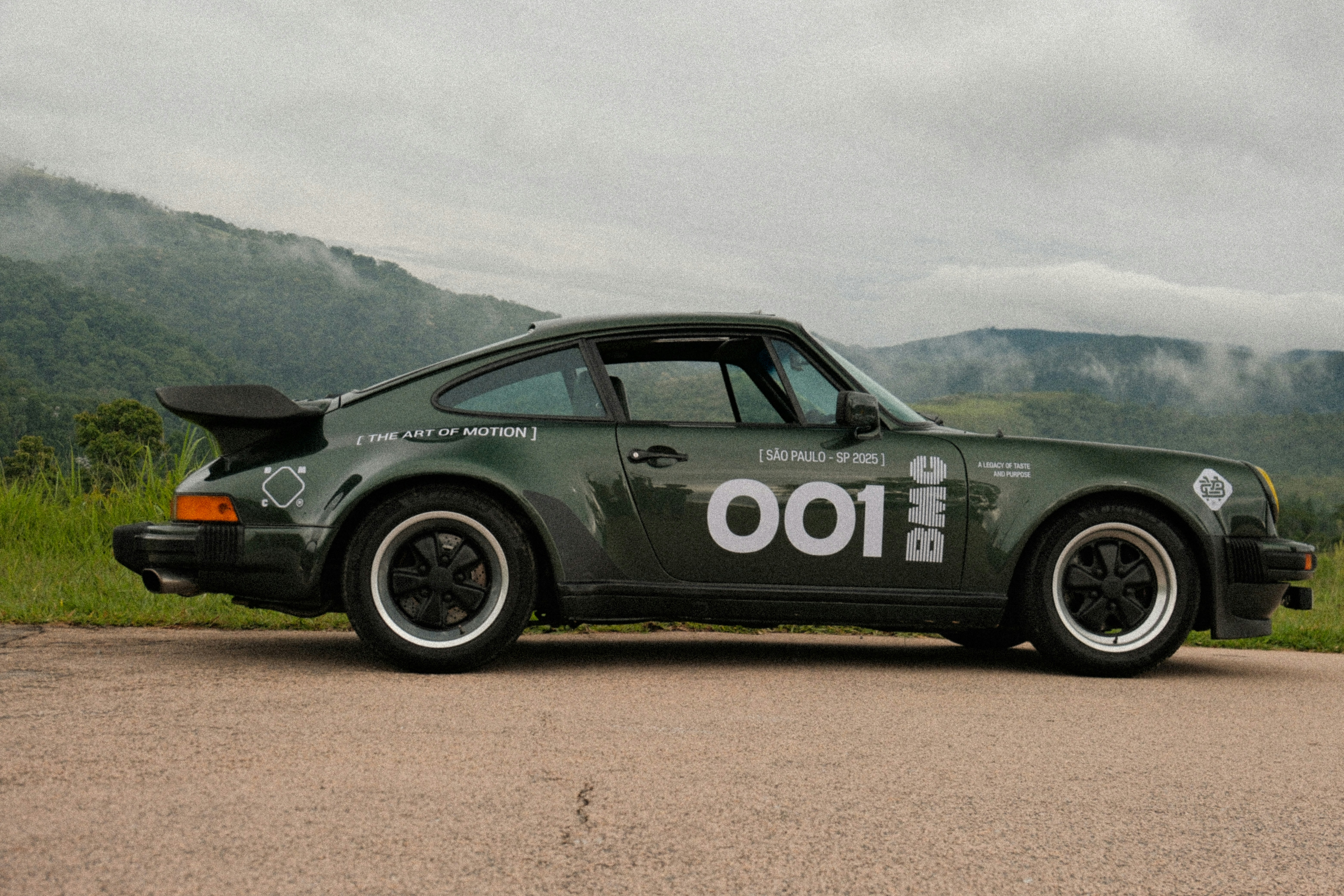 Green Porsche 911 Racing Legend on Open Road