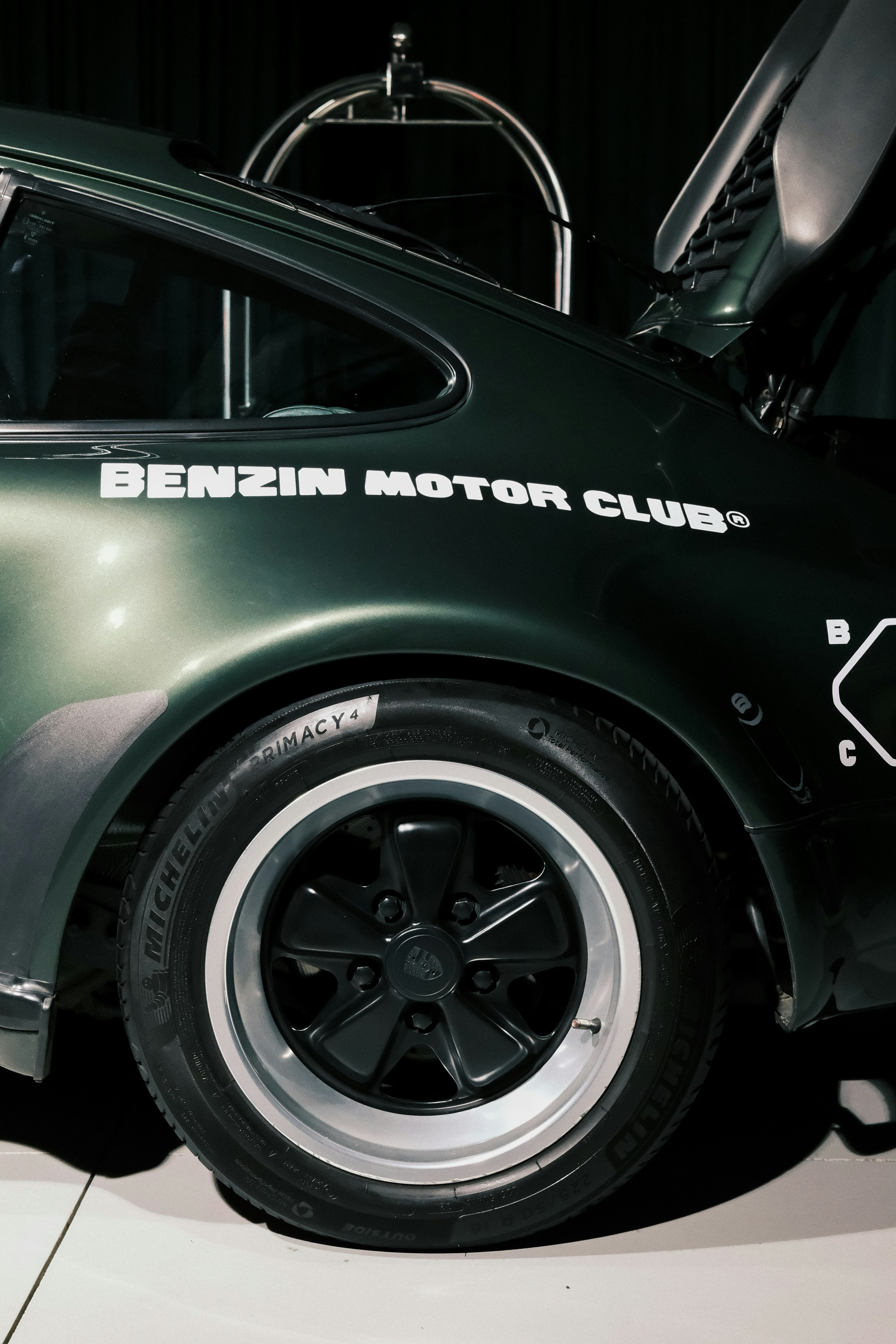 Green Classic: A Vintage Porsche Silhouette and Emblem