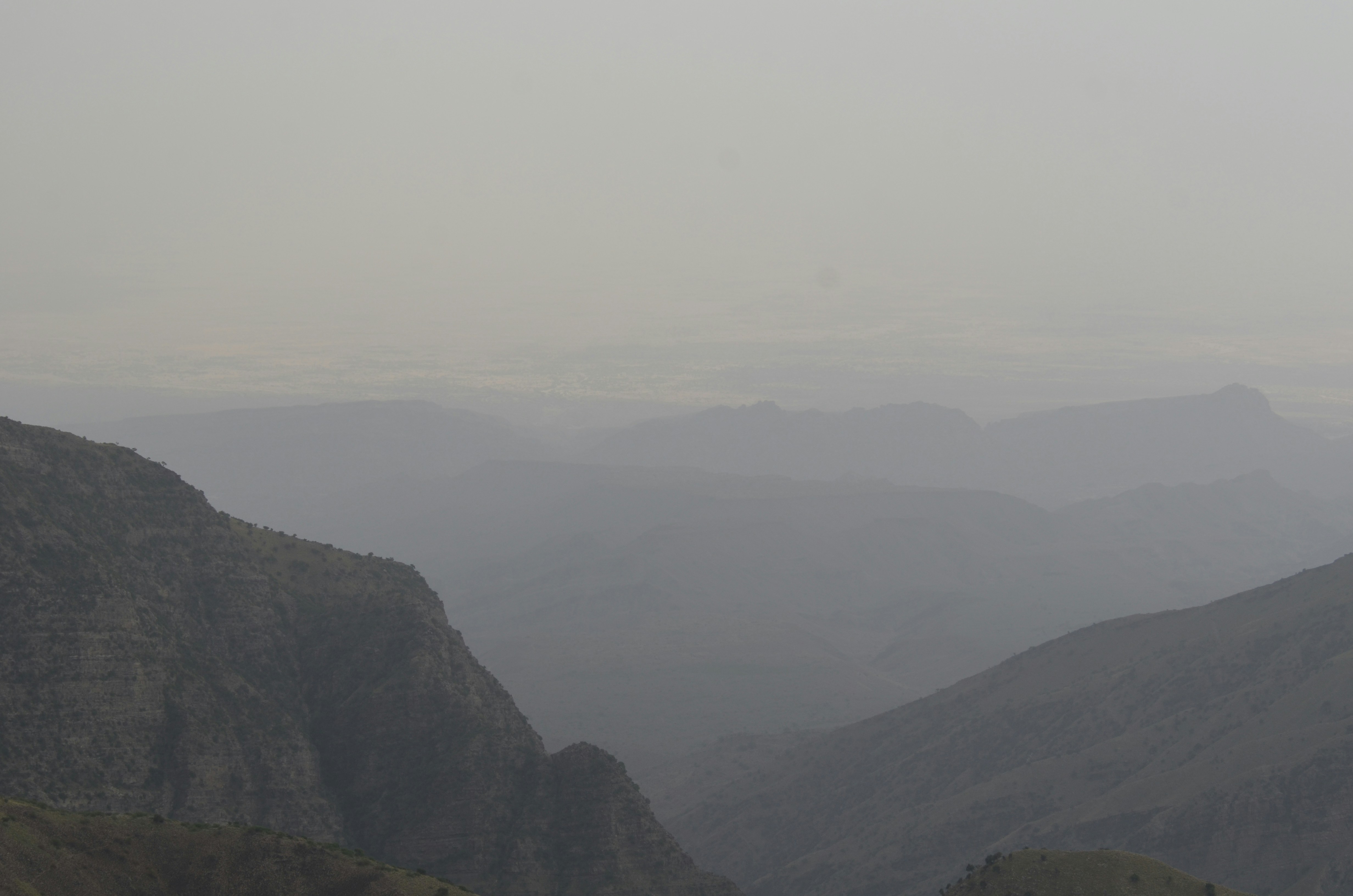 Valley Mist: Layers of Distant Peaks Through Morning Haze