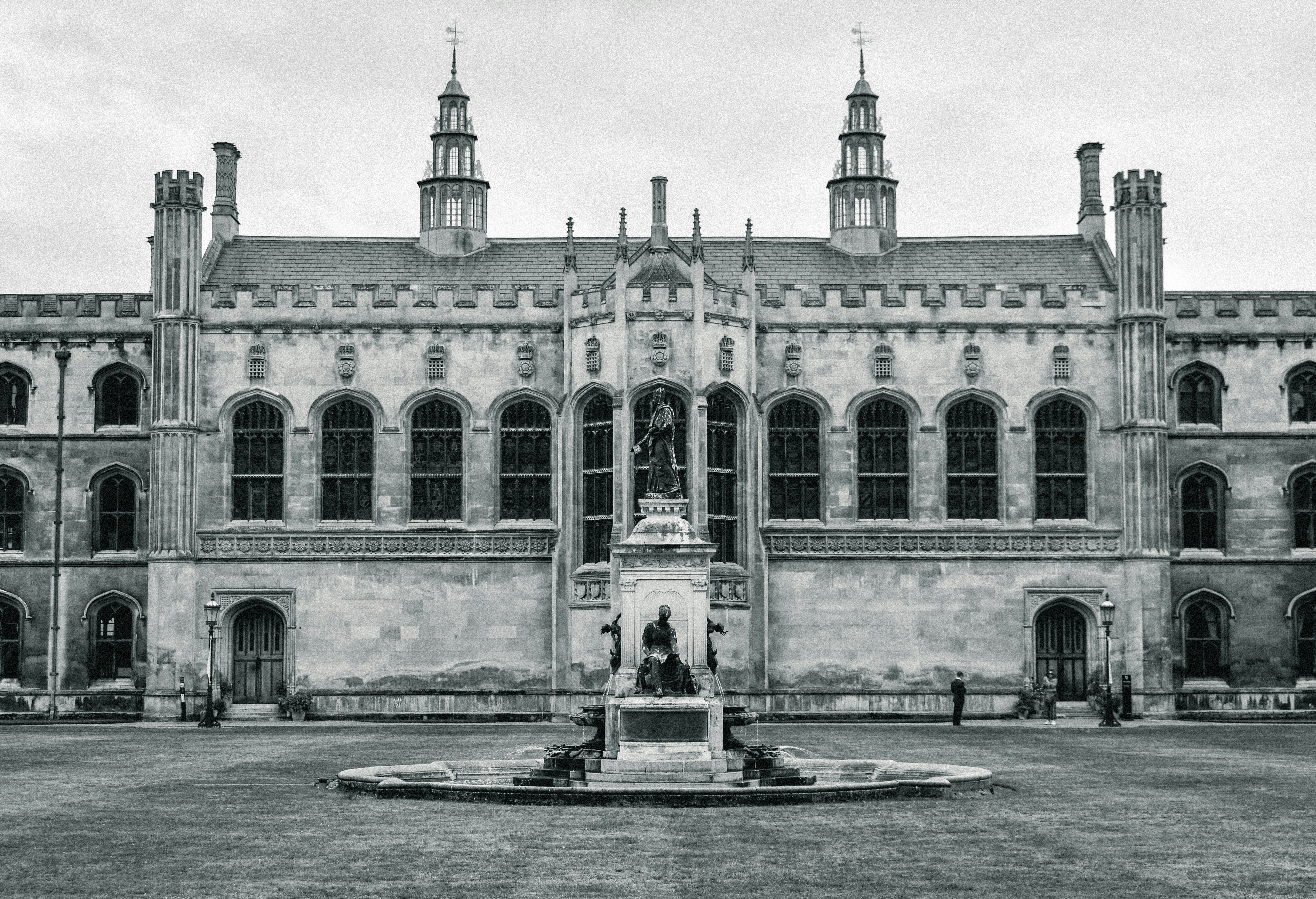 Symmetrical Facade: A Central Fountain Framed by Historic Windows
