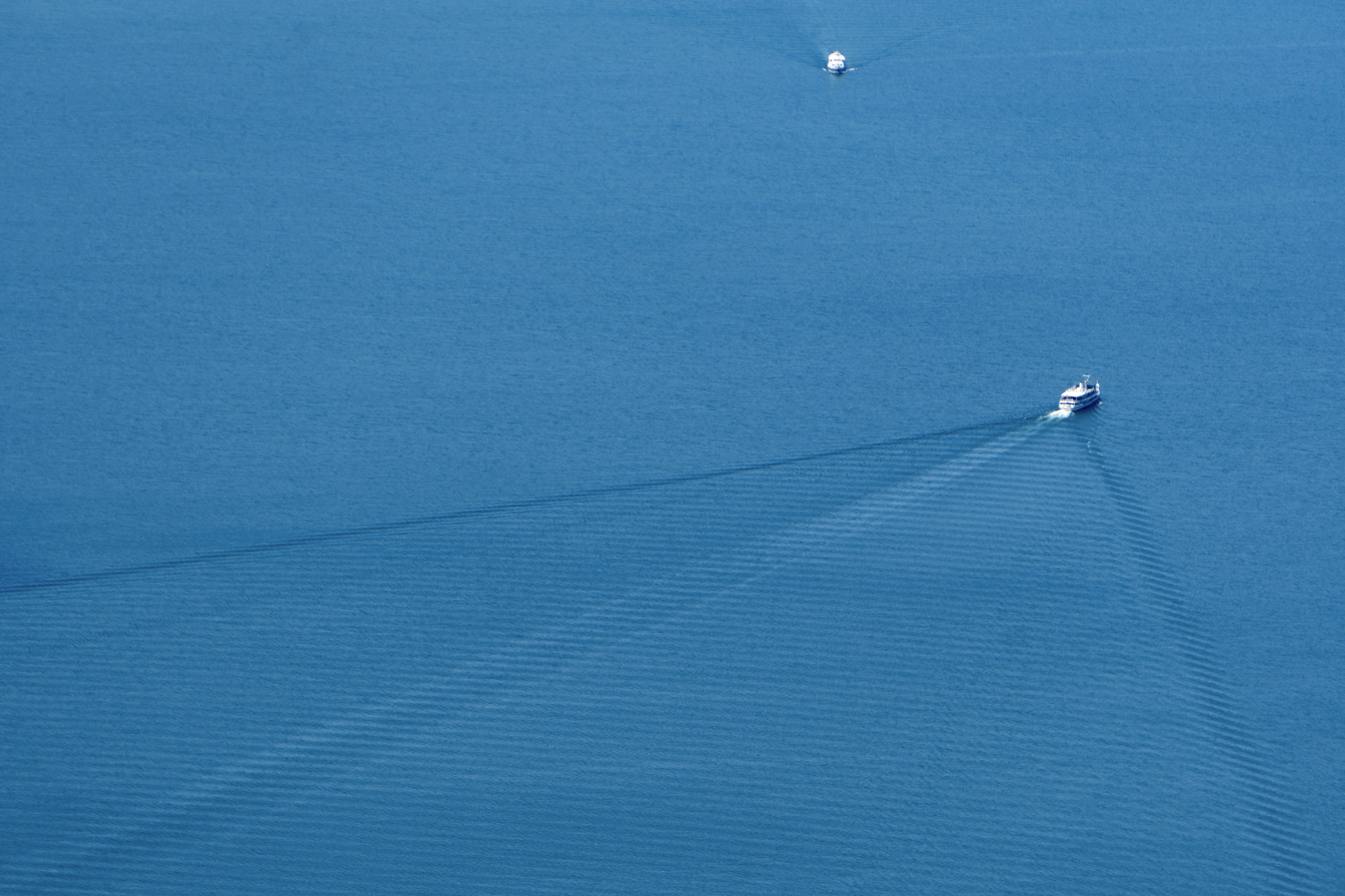 Blue Wake: Dual Vessels Plow Quiet Seas