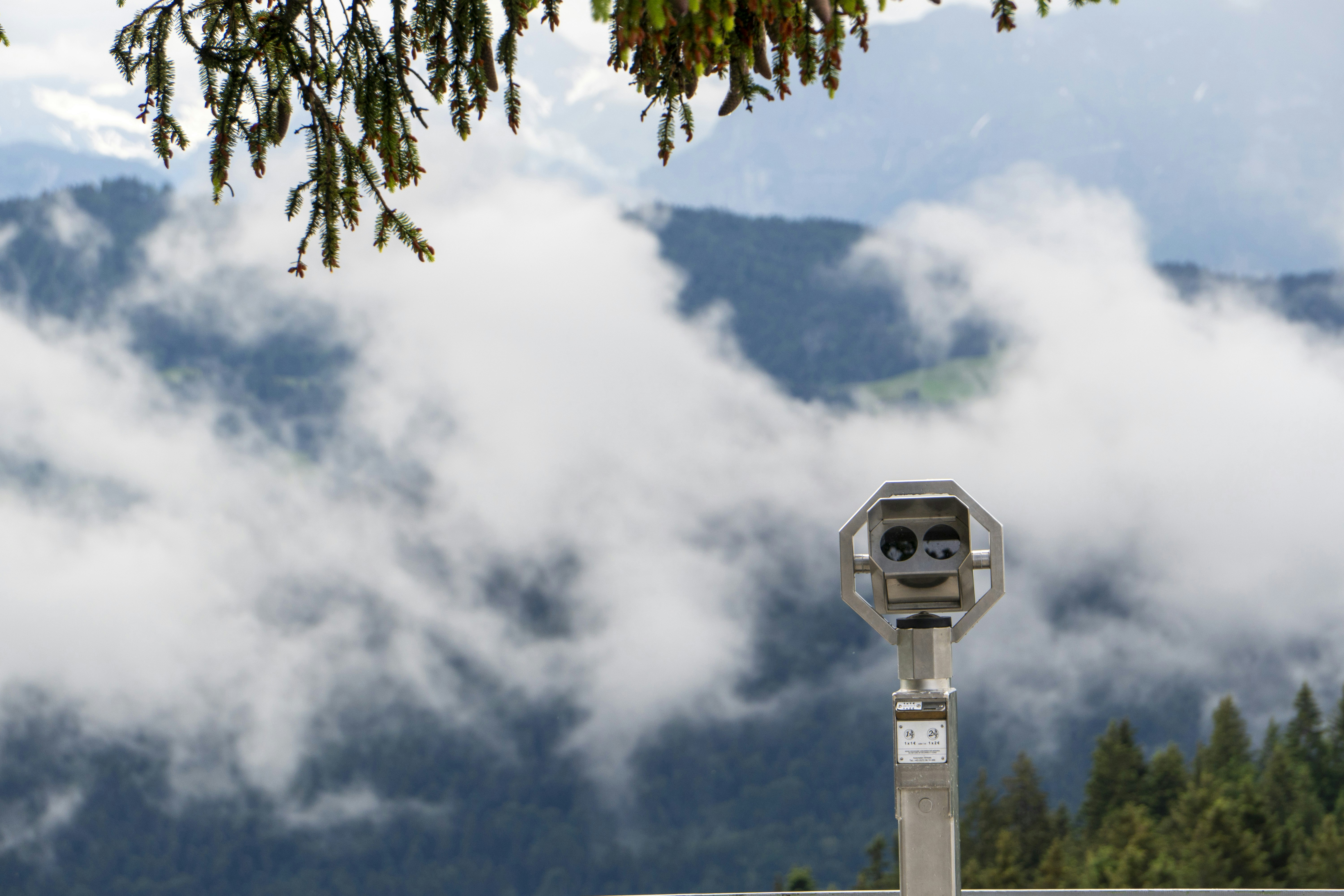 Mountain Observatory Gaze: A distant Viewfinder Amid Clouds