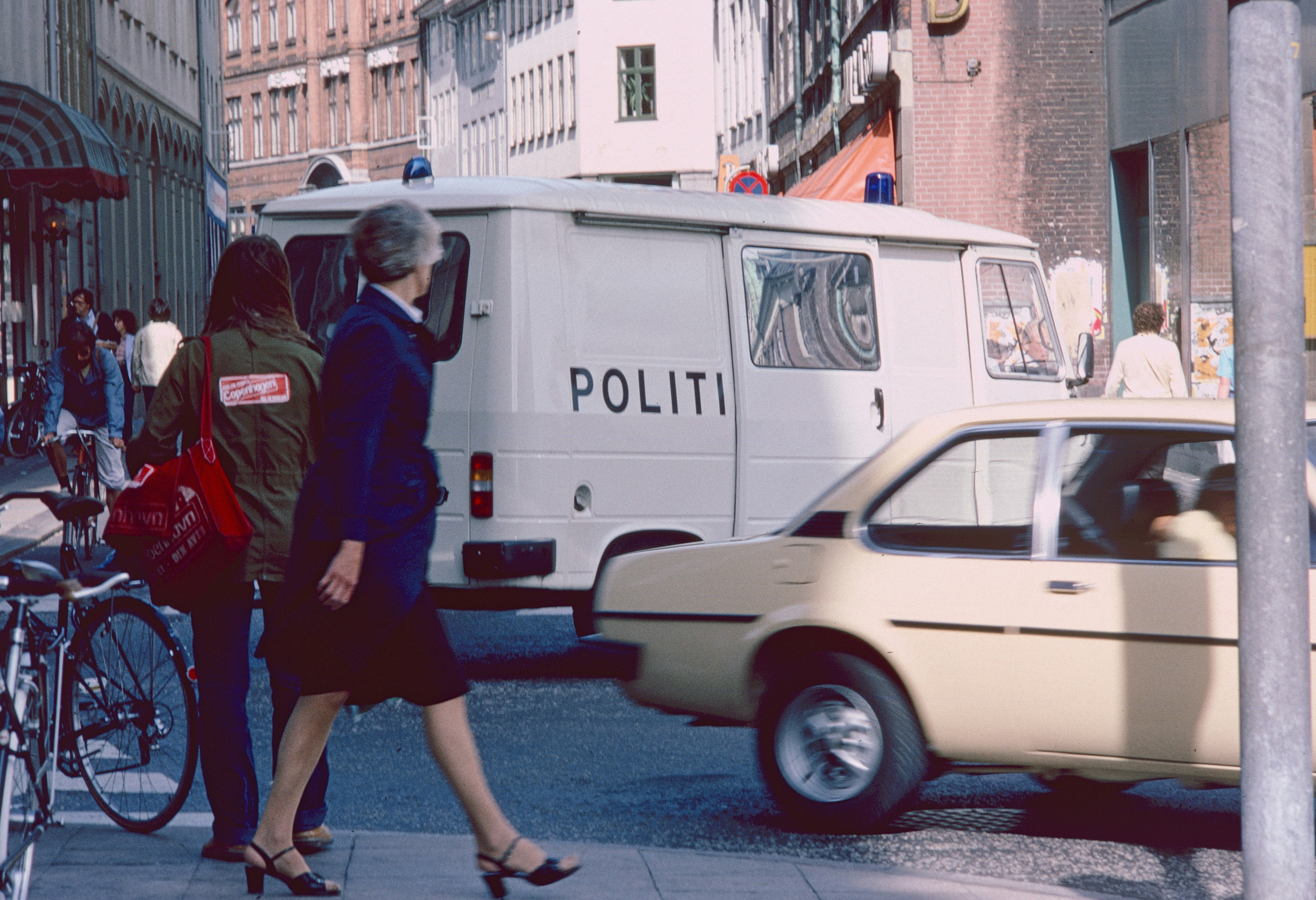 A police van seen from Gammel Torv looking toward Skindergade on a busy summer afternoon in Copenhagen, Denmark, in the late 1970s.