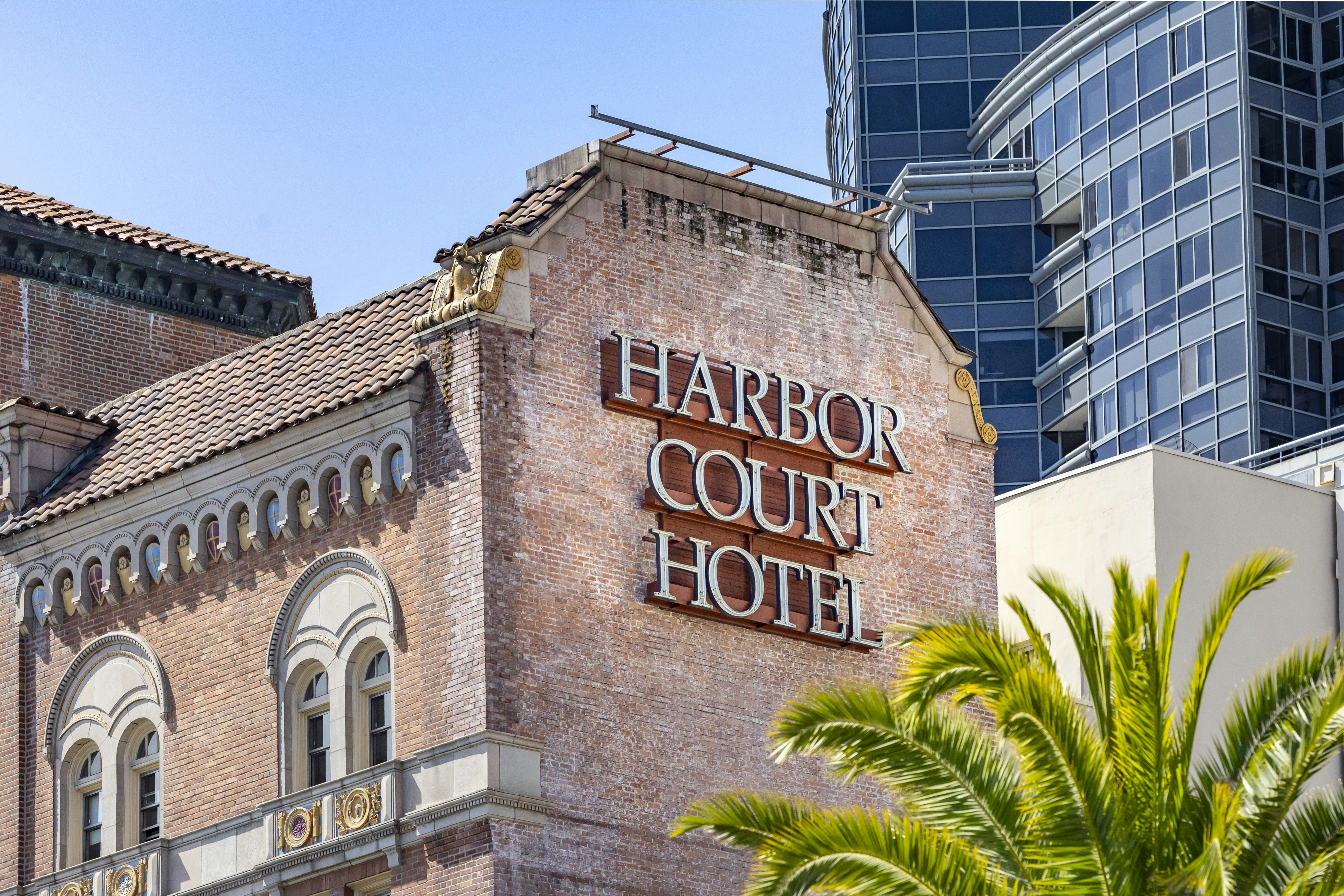 Brick Facade Rise: Harbor Court Hotel Juts into a Sky of Modern Glass