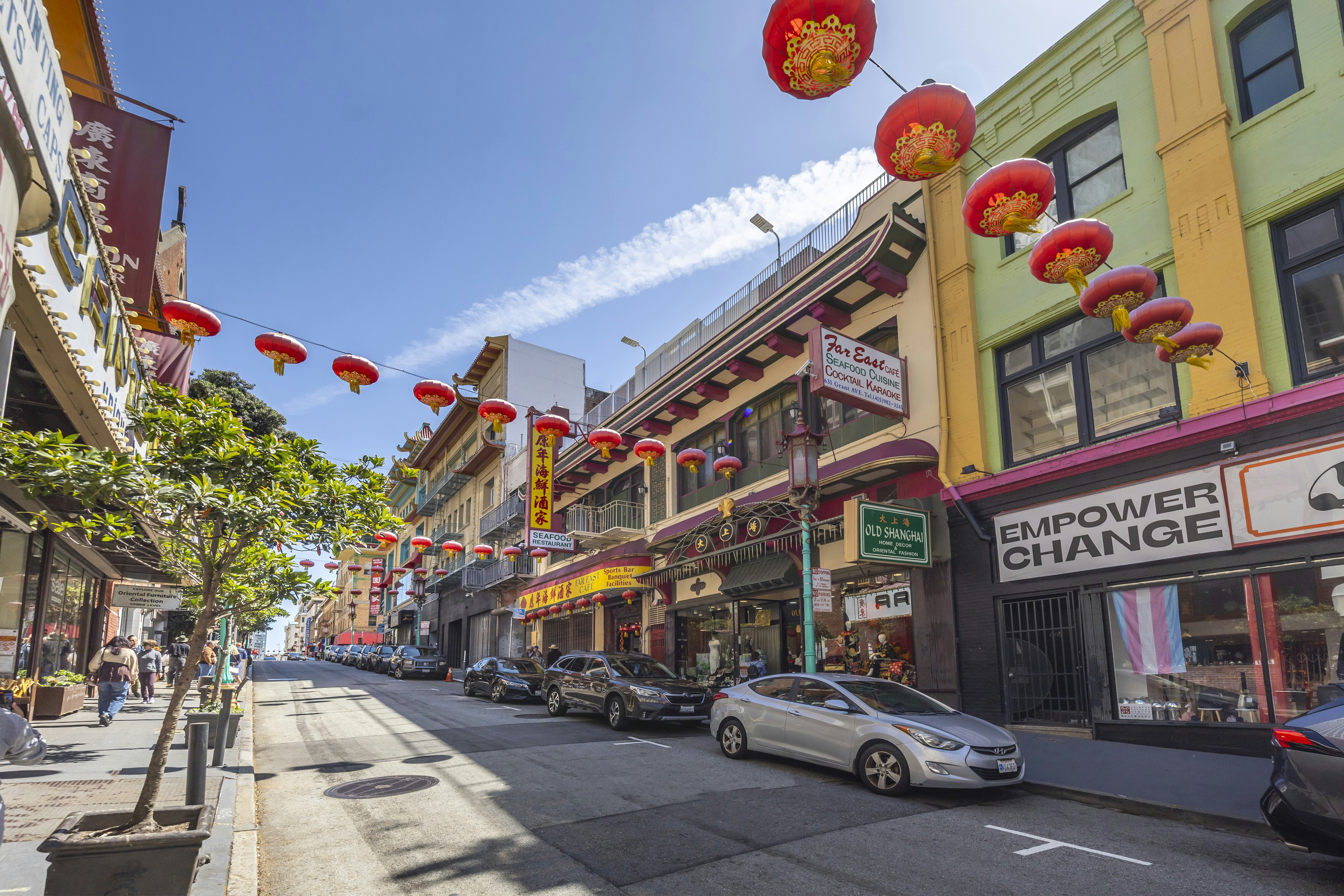 Vibrant chinatown street decorated with traditional red lanterns.