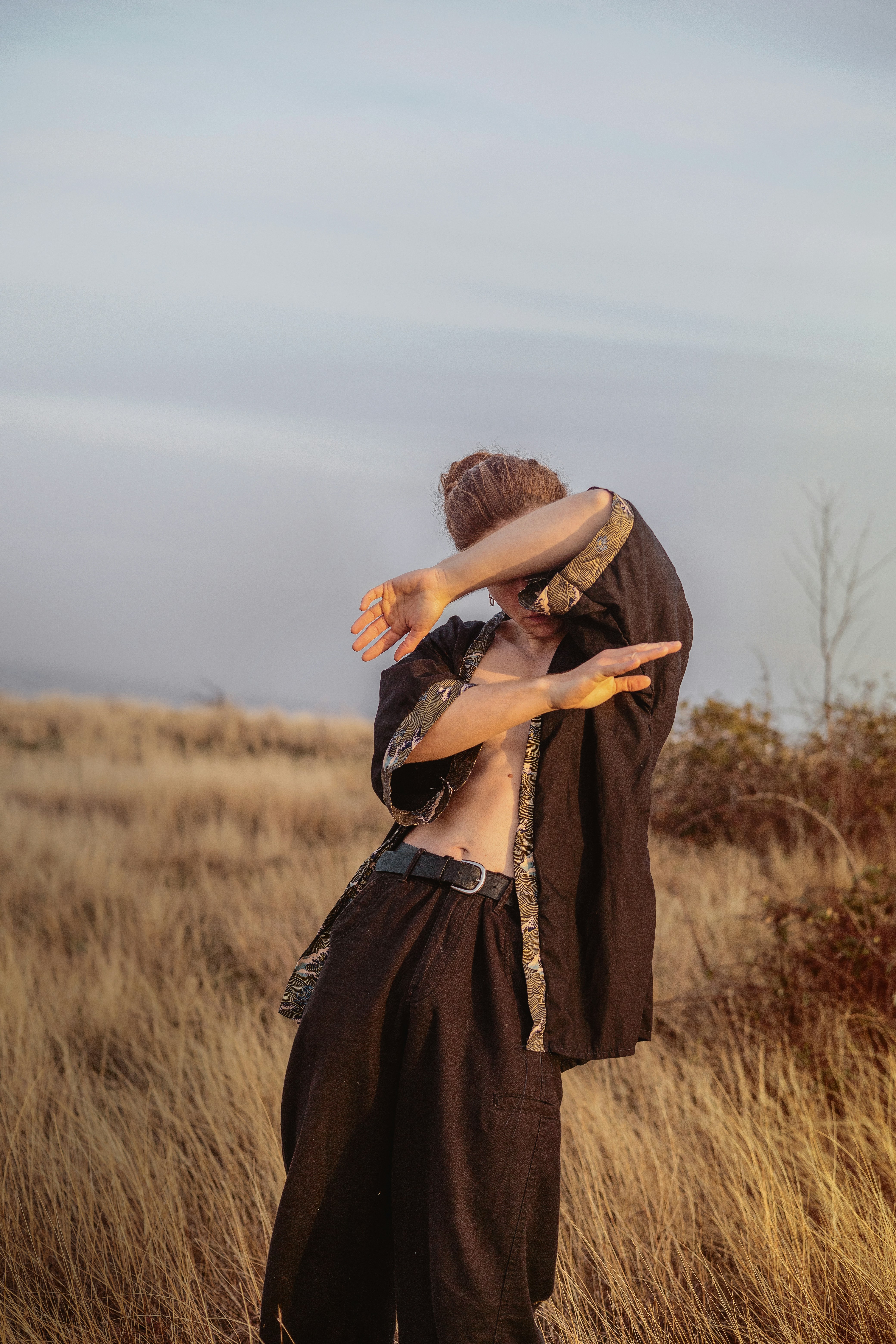 Autumn Dusk: Dancers in a Field Find a Quiet Pause