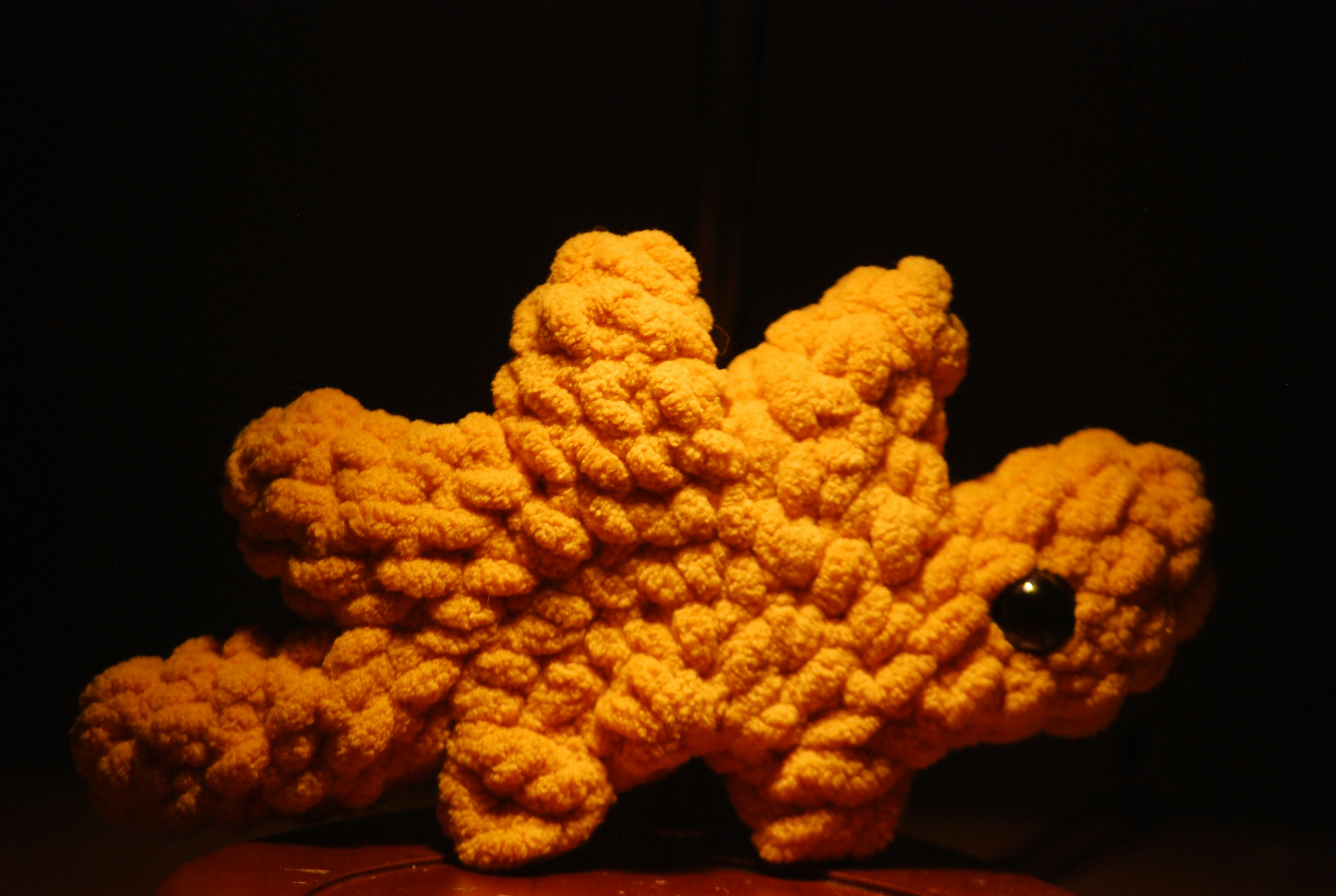 Amber Cloud Creature: A Plush Alchemist in Golden Spotlight