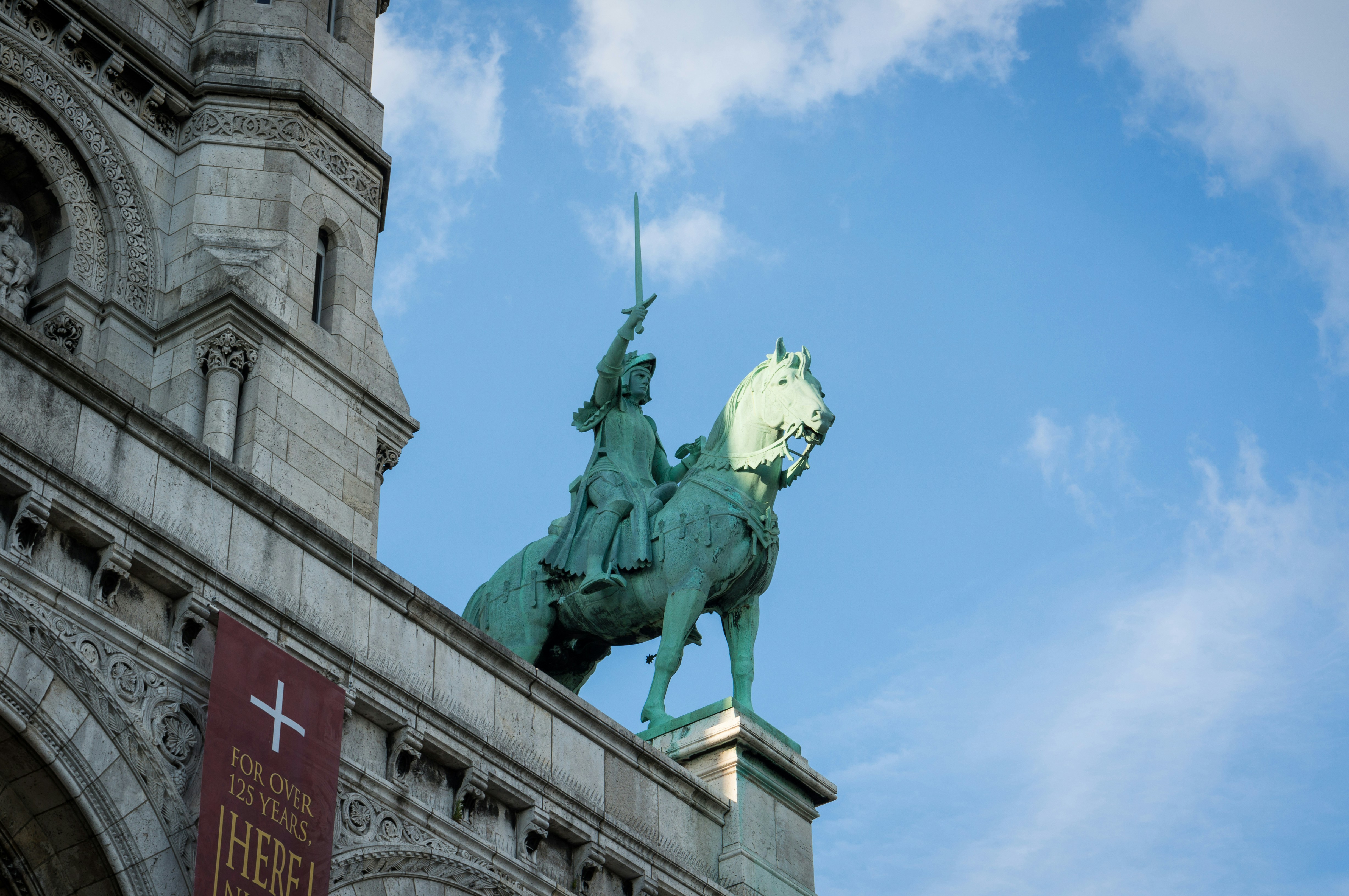 Equestrian Majesty: A Statue’s Gaze Under Blue Skies