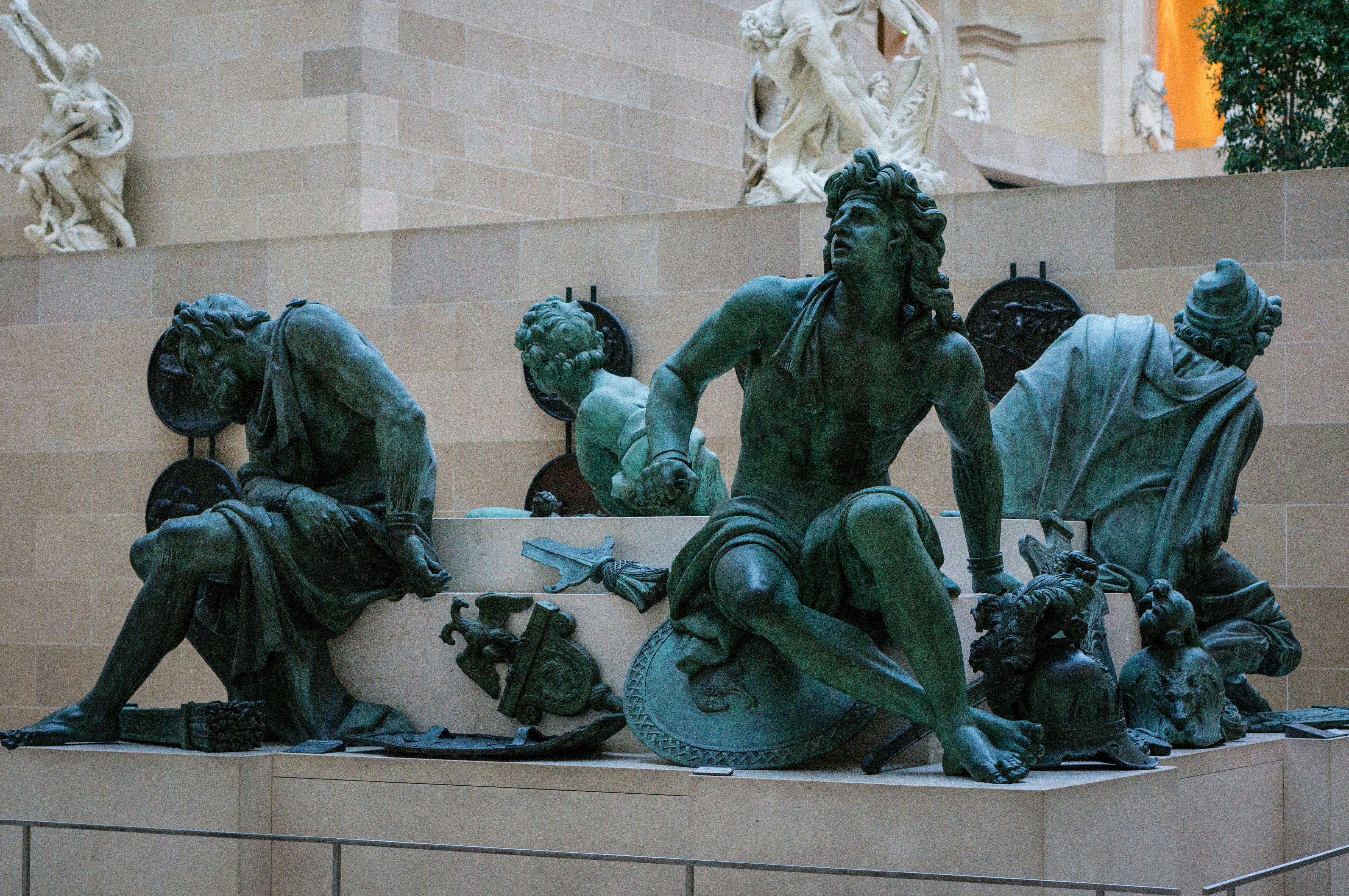 Verve of the Inferno: Bronze Figures in a Stone Wake