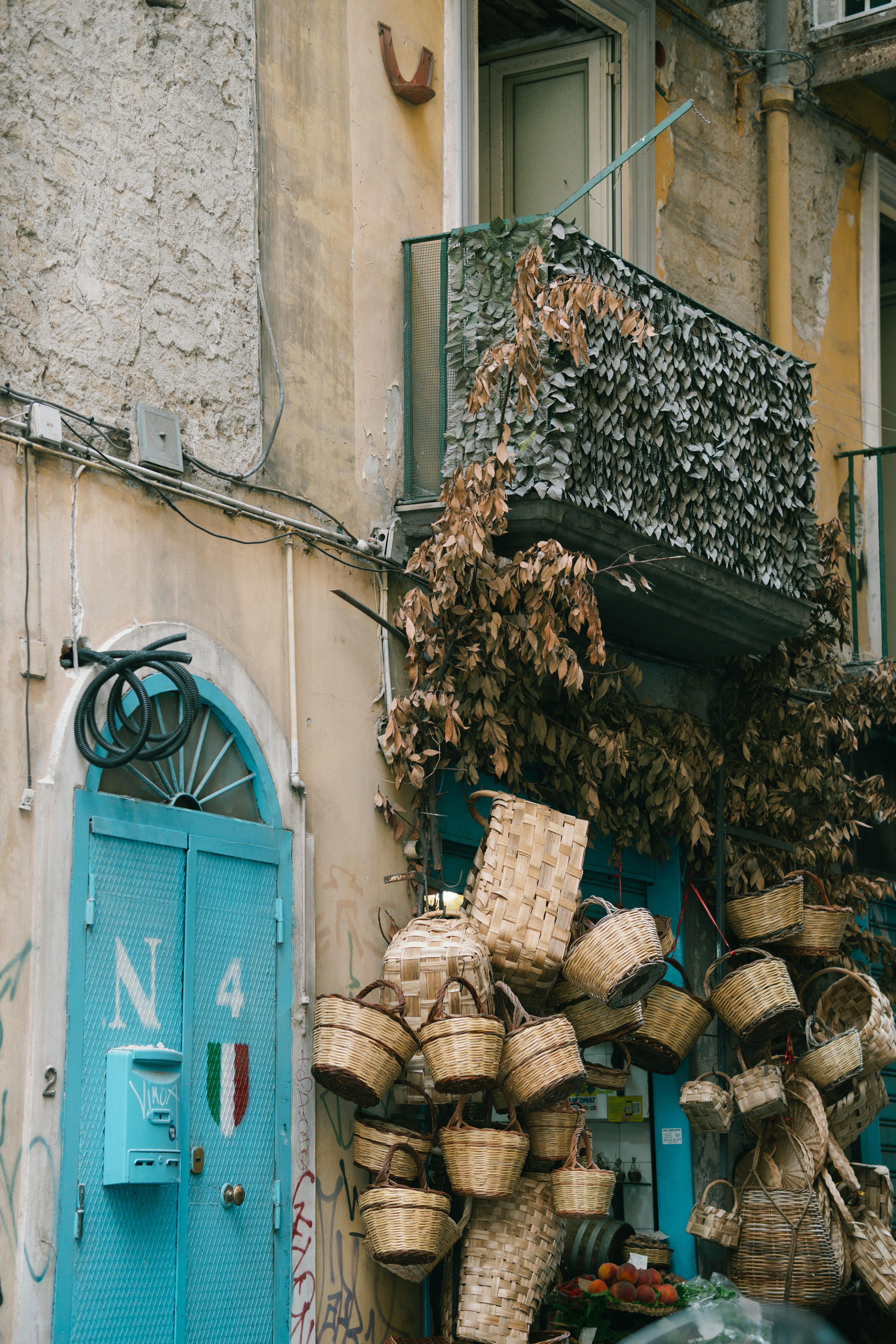 Blue Arches and Woven Baskets: A Quiet Corner of Colorful Street Life