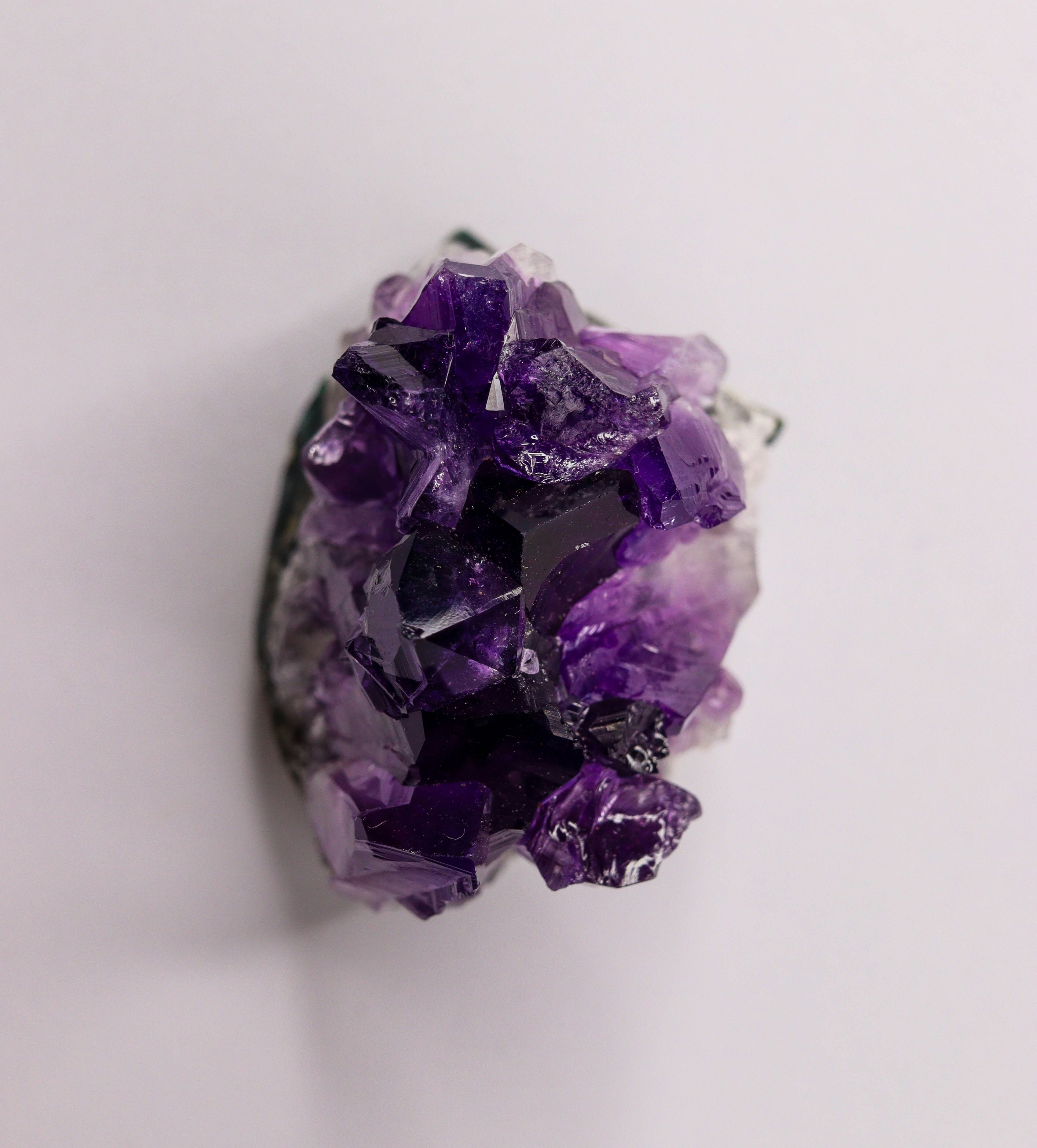 Vivid Amethyst Crest: Faceted Geometry on White