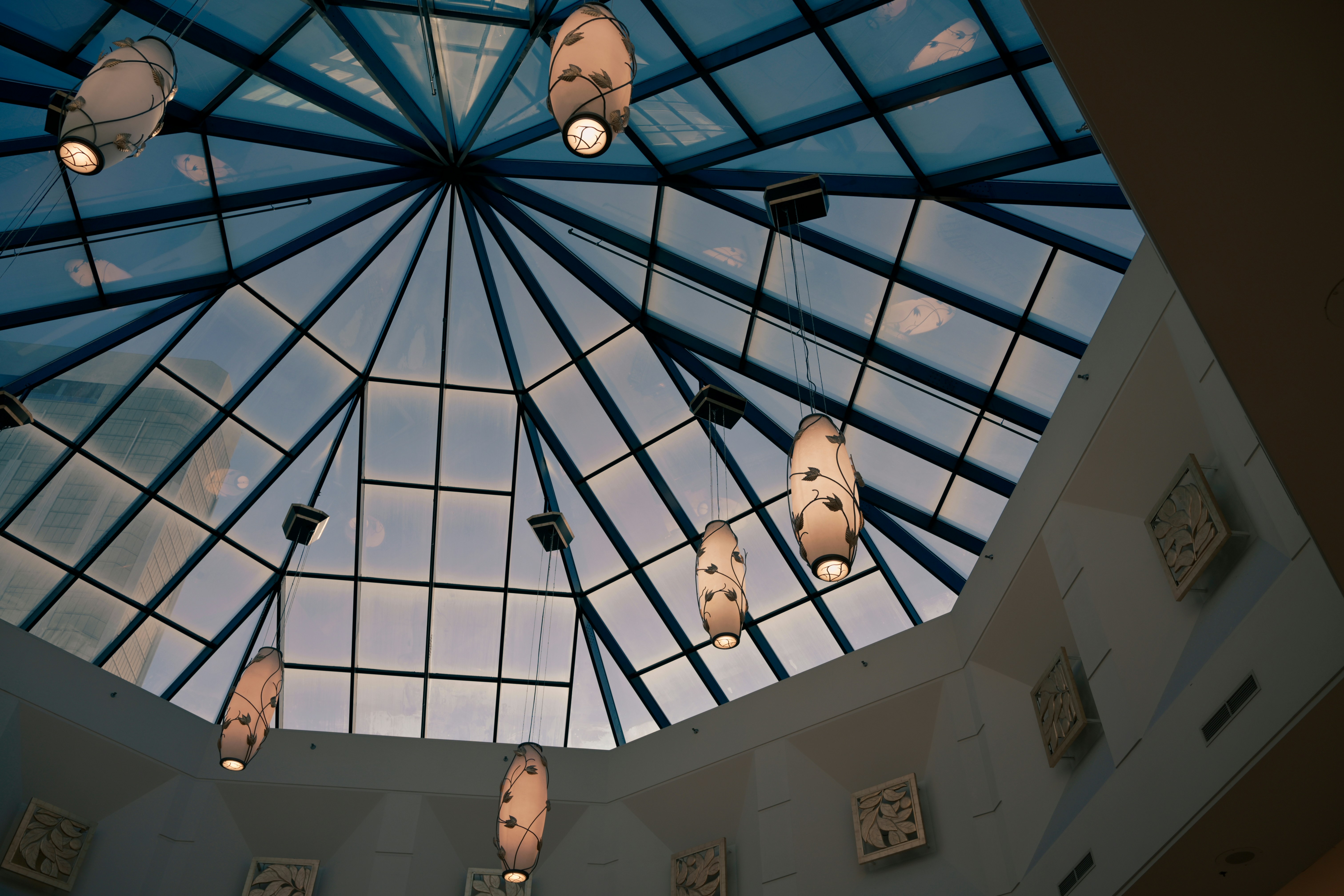 Midday Lanterns Beneath a Geometric Glass Dome