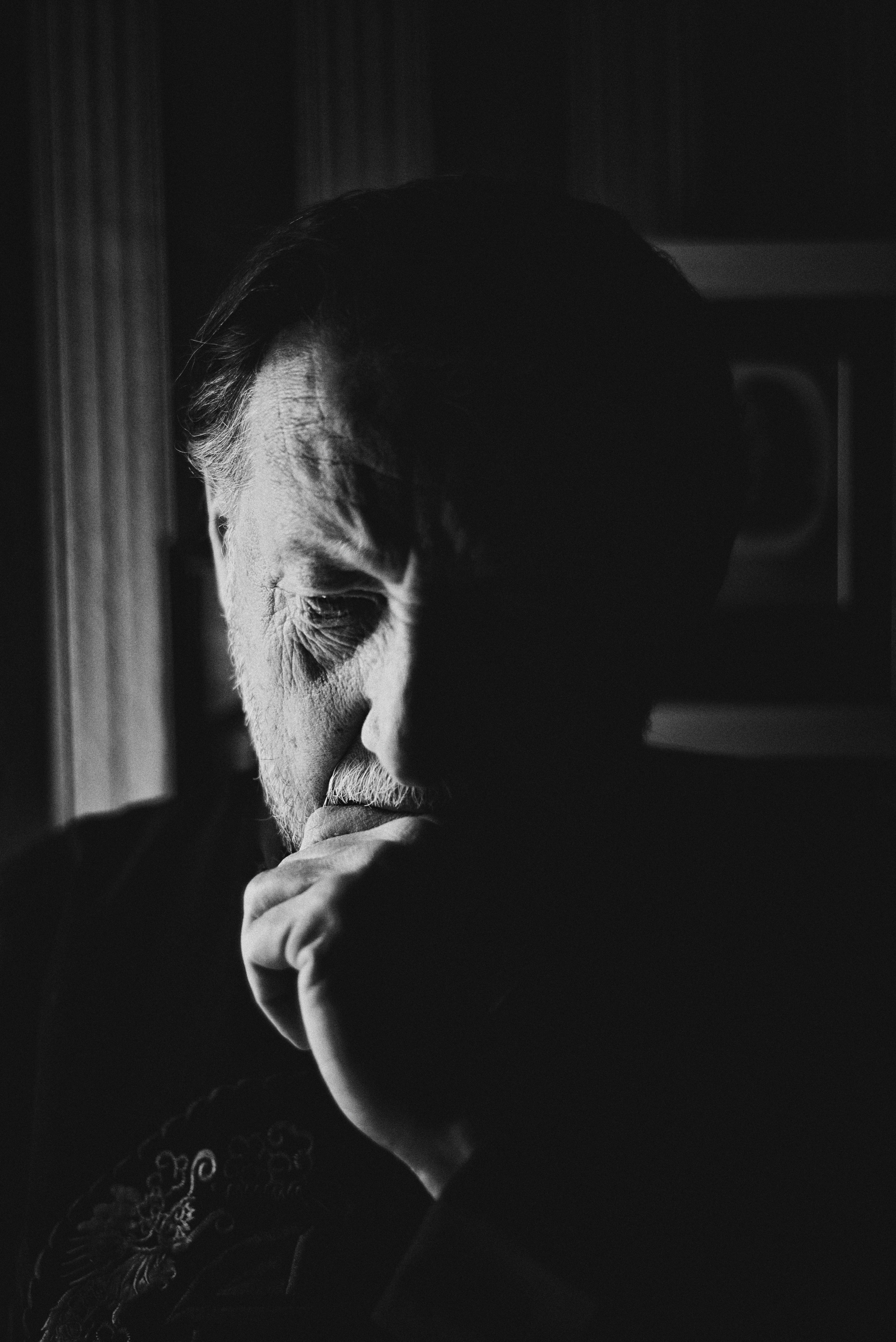Shadowed Contemplation: A Quiet Moment in Monochrome
