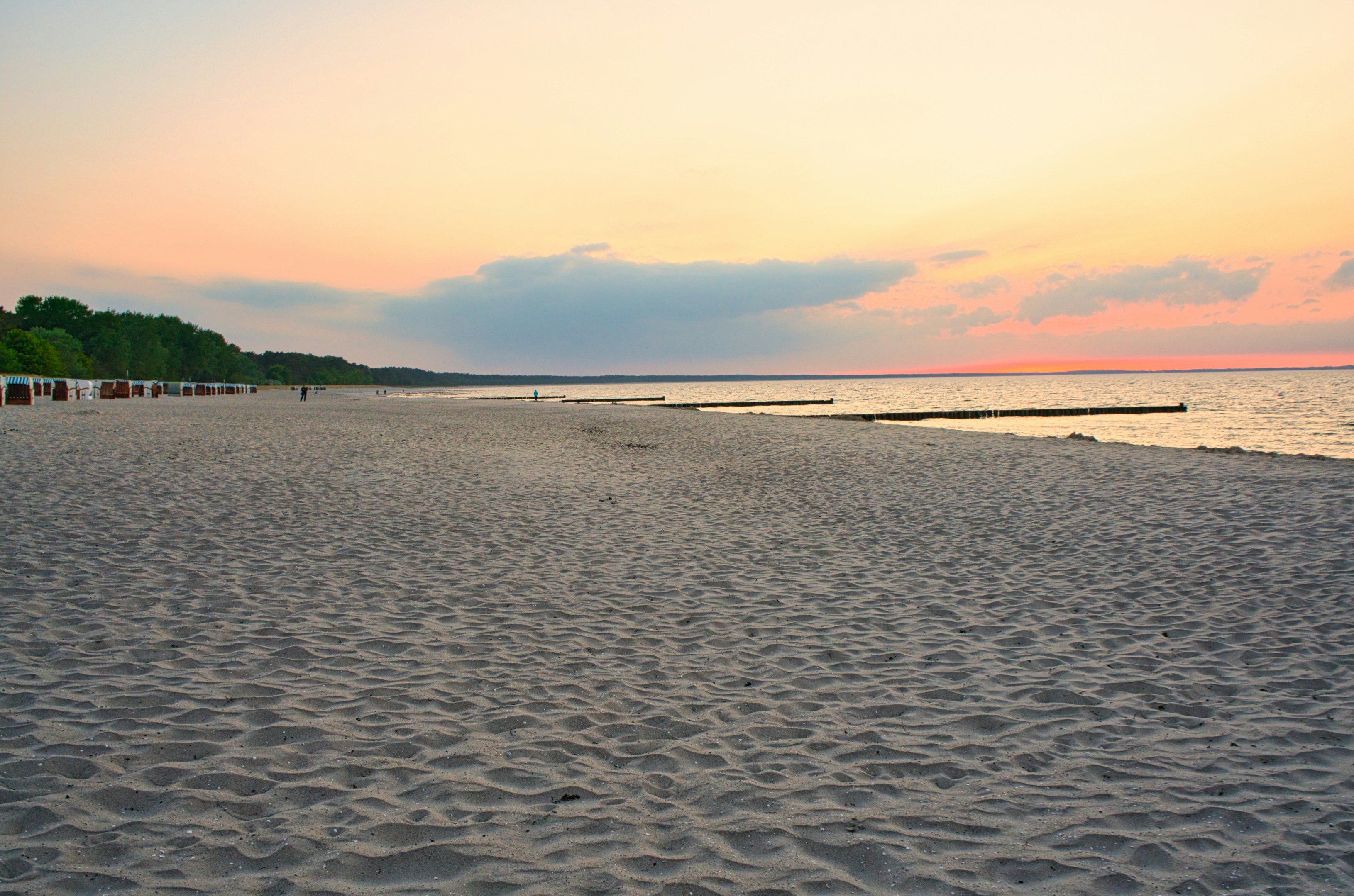 Calm Shore at Sunset: A Quiet Long Beach