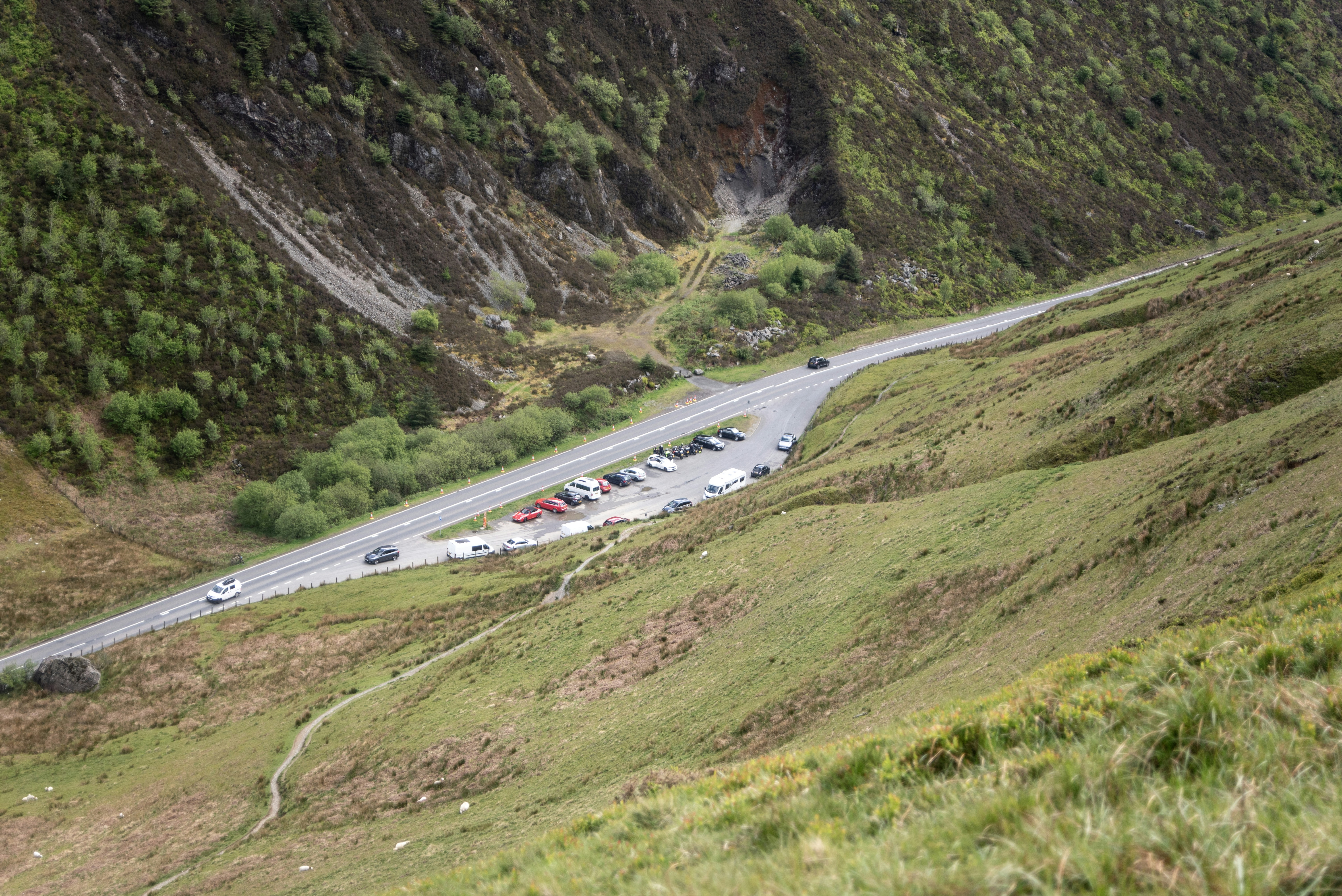 Turning Curve: Cars Snaking Through a Curved Pass in the Hillside
