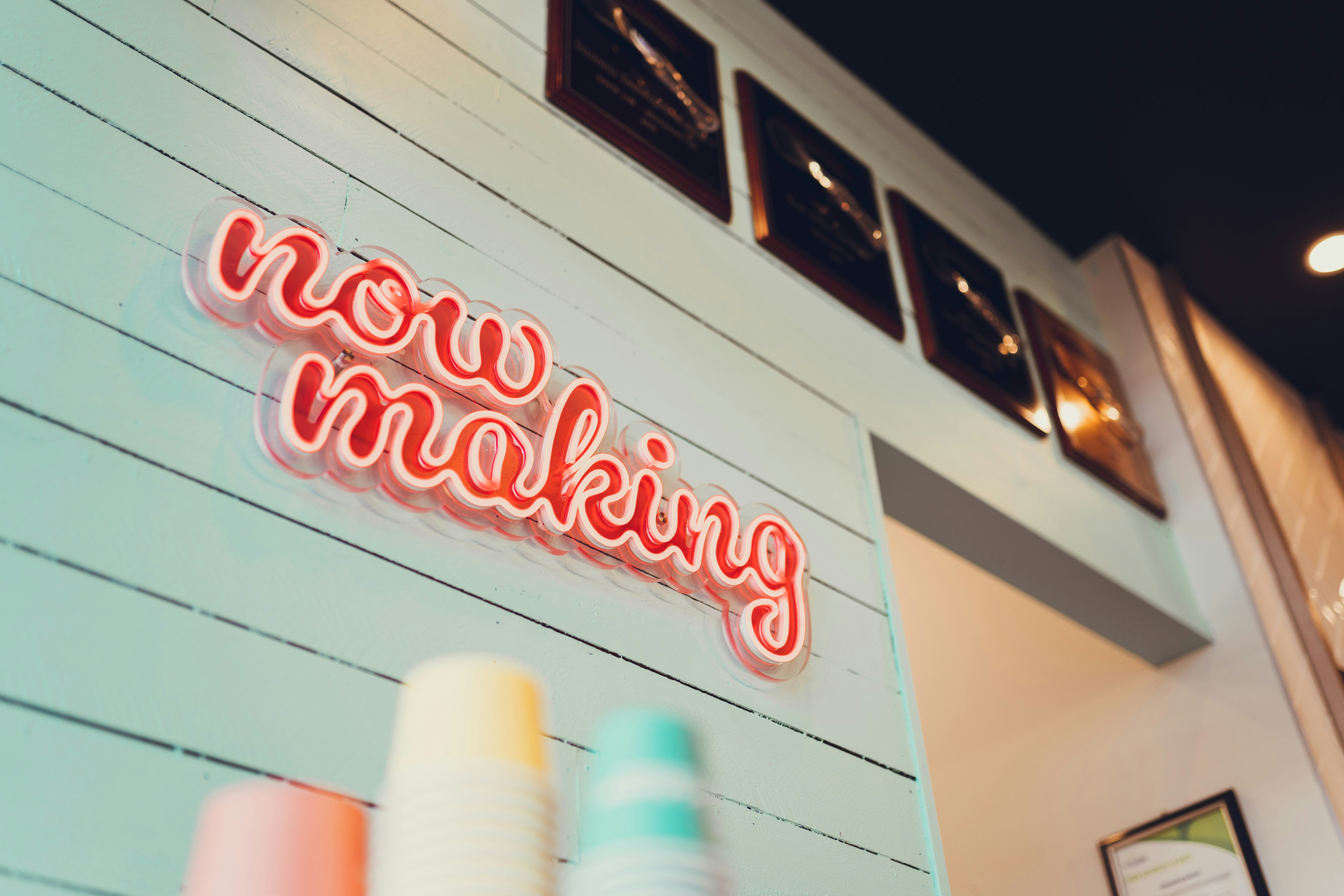 Neon Sign in Soft Pastel Café Exterior