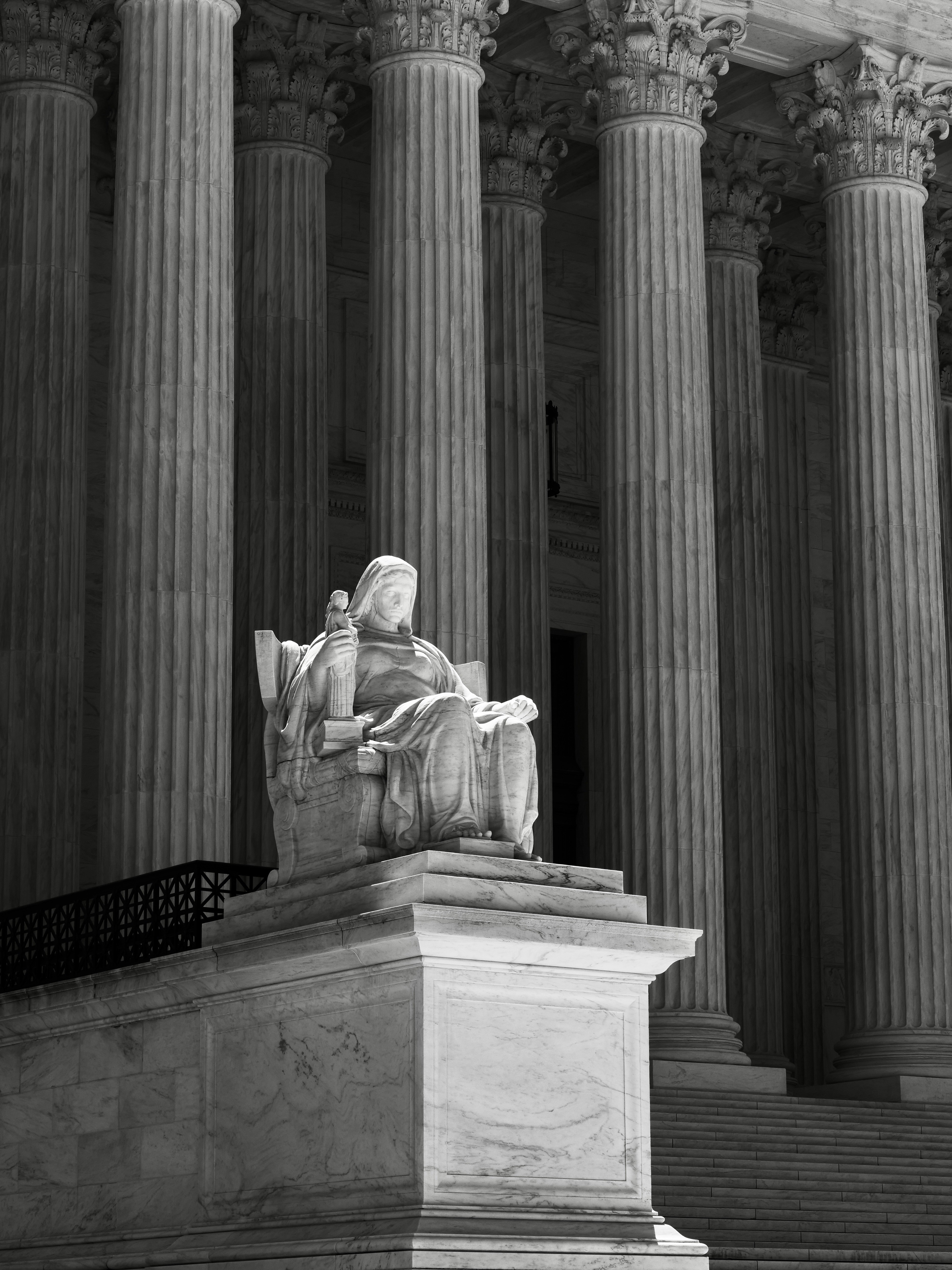 The Colonnade Sentinel: Marble Frieze Amidst Dawn of Columns