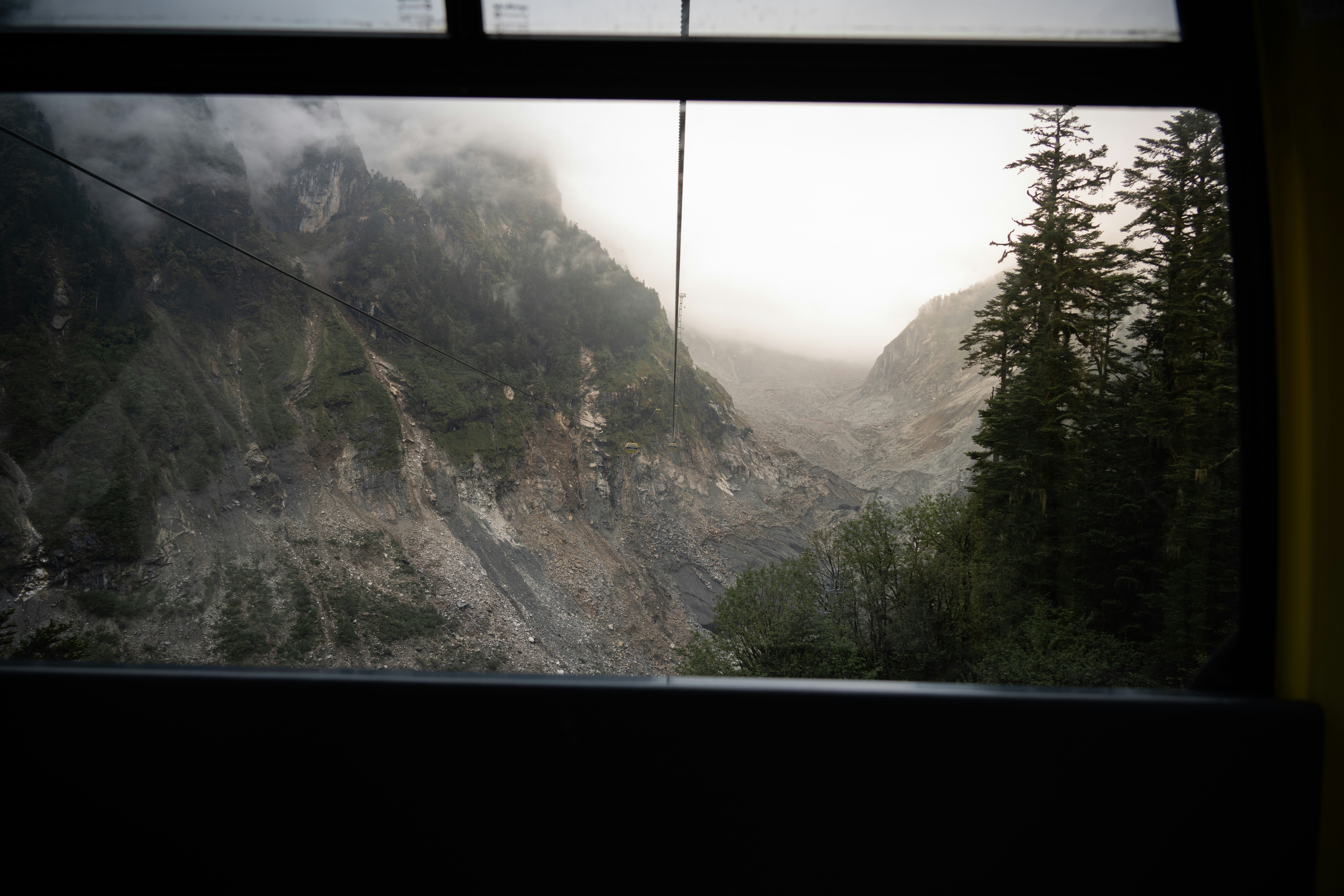 Windowed Gorge: Mountain Pass Framed by Tree Line
