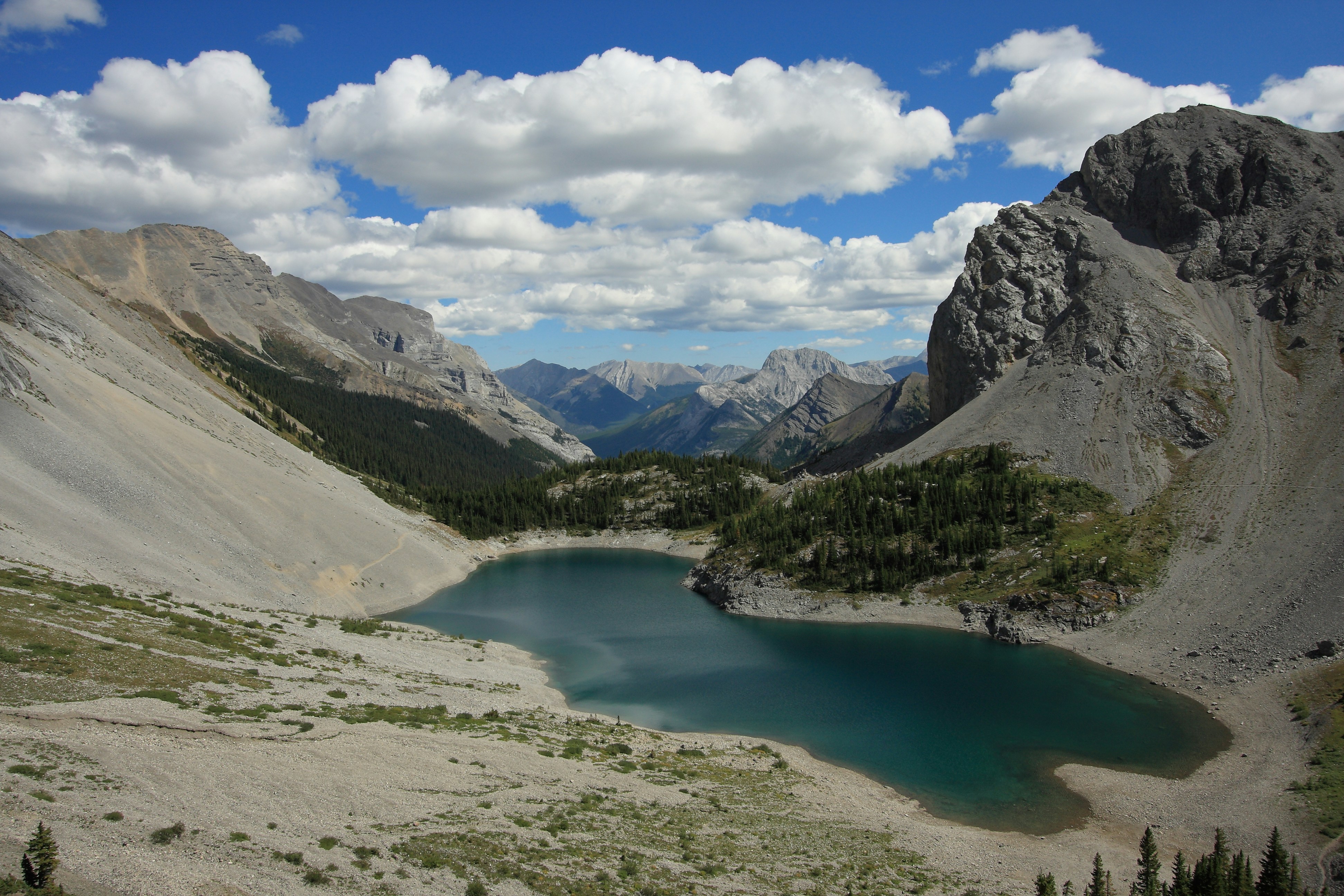Azure Alpine Mirror: A Glacier-fed Lake Surrounded by Granite Giants