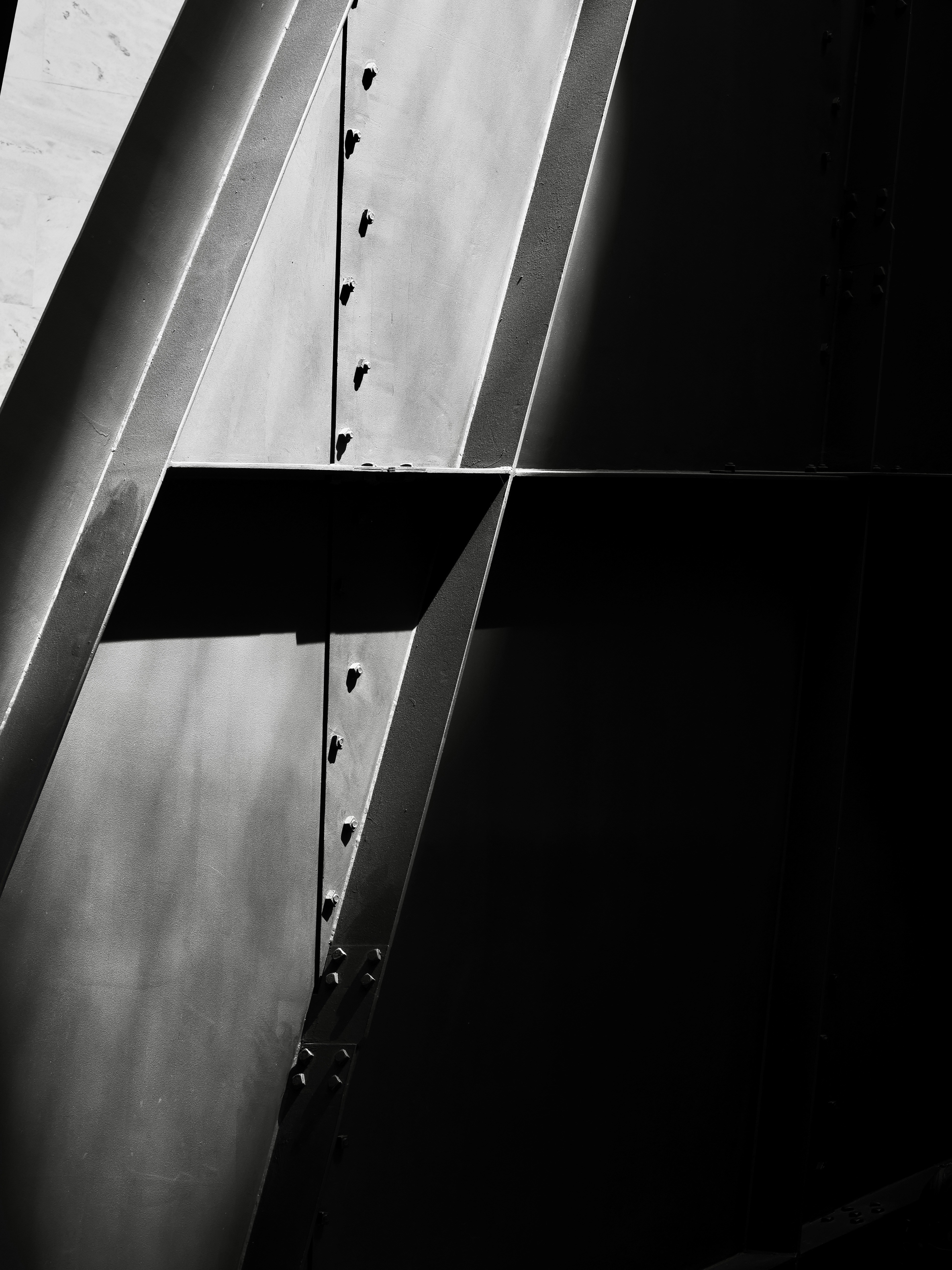 A large piece of black metal with bolts