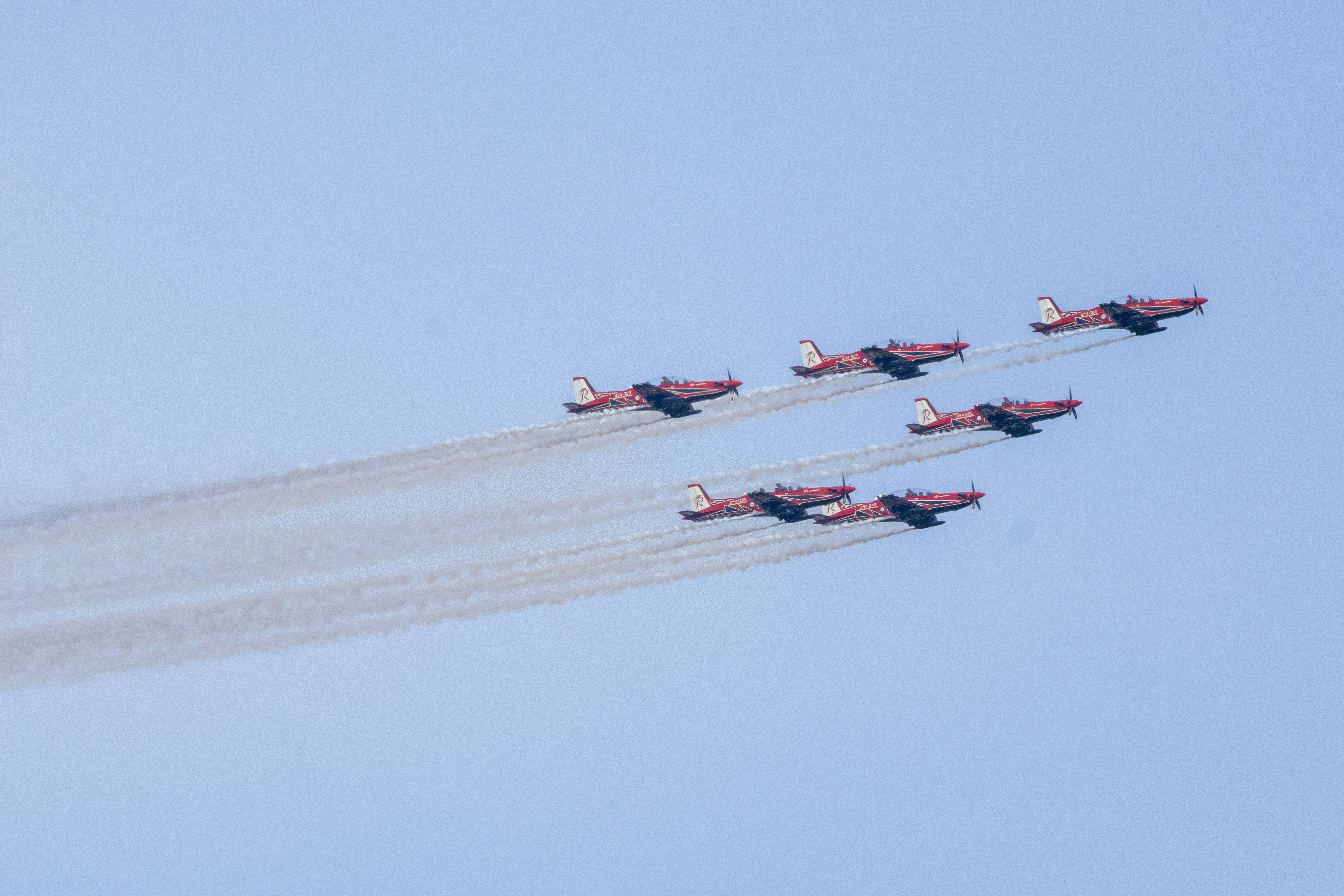 Sleek Formation: Six Aerial Demonstrators Trace a Clean Derby in Blue