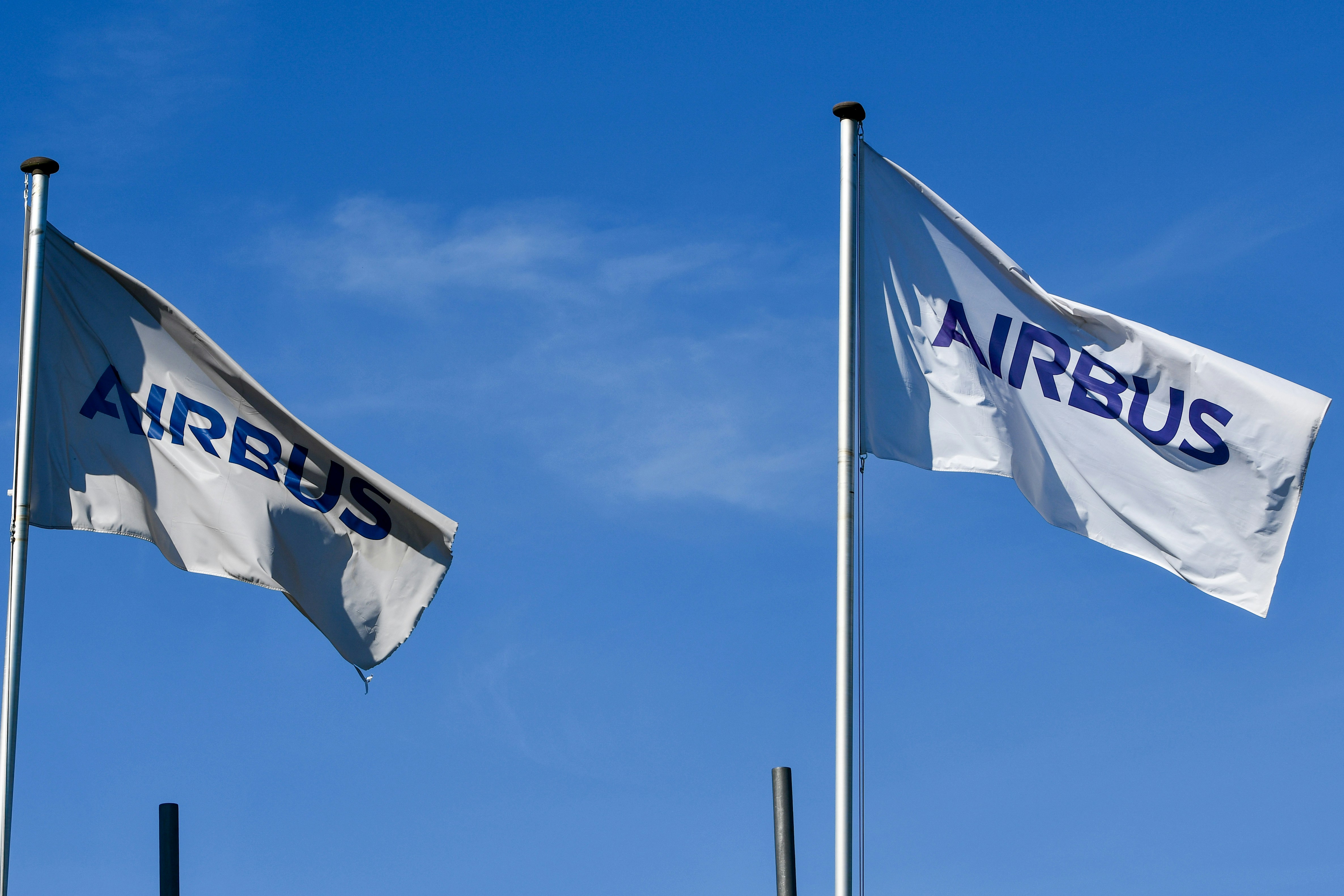 Flags of a Quiet Sky: Airbus Emblems Against a Clear Blue