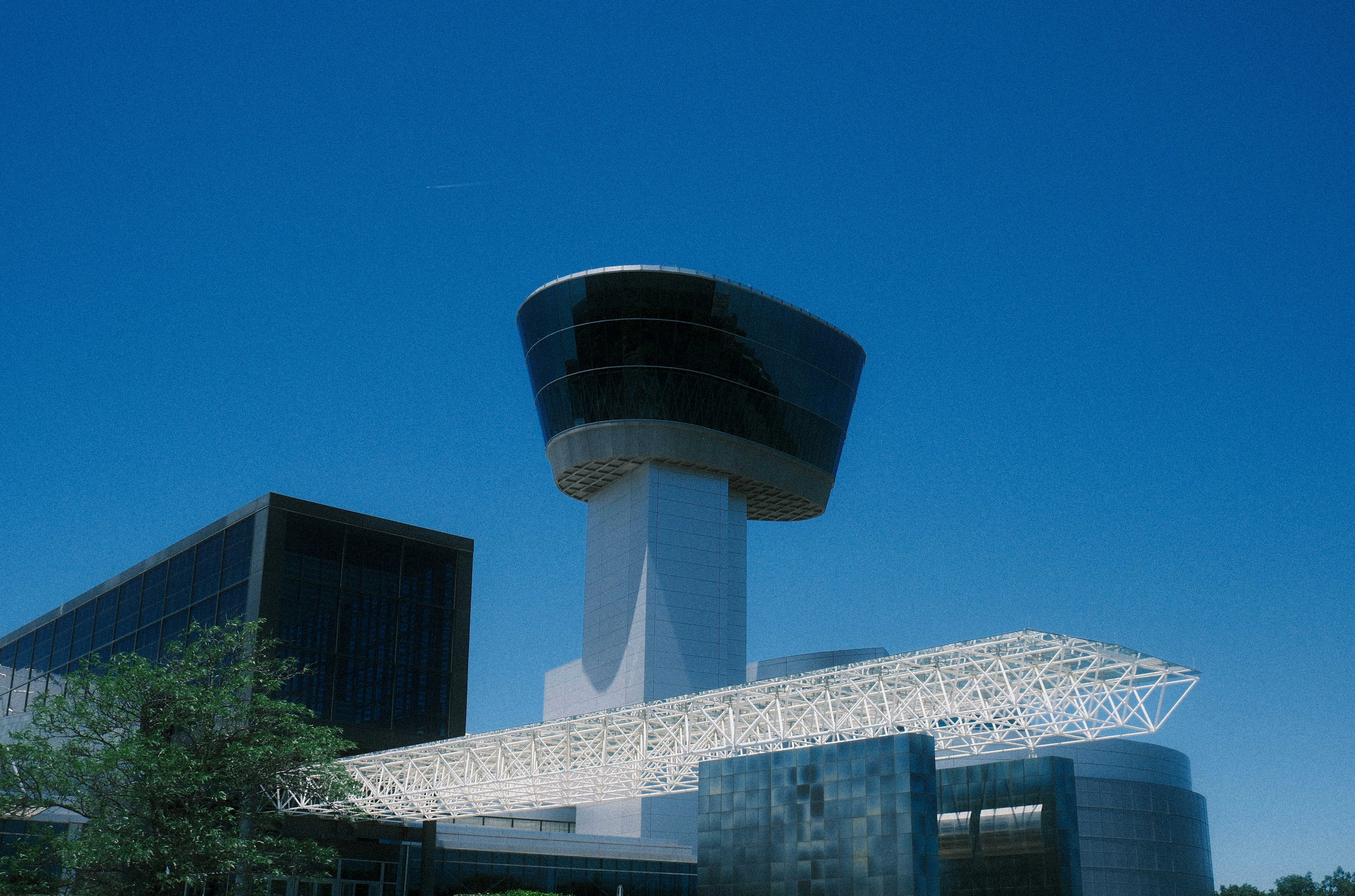 Control Tower Silhouette Above a Modern Terminal