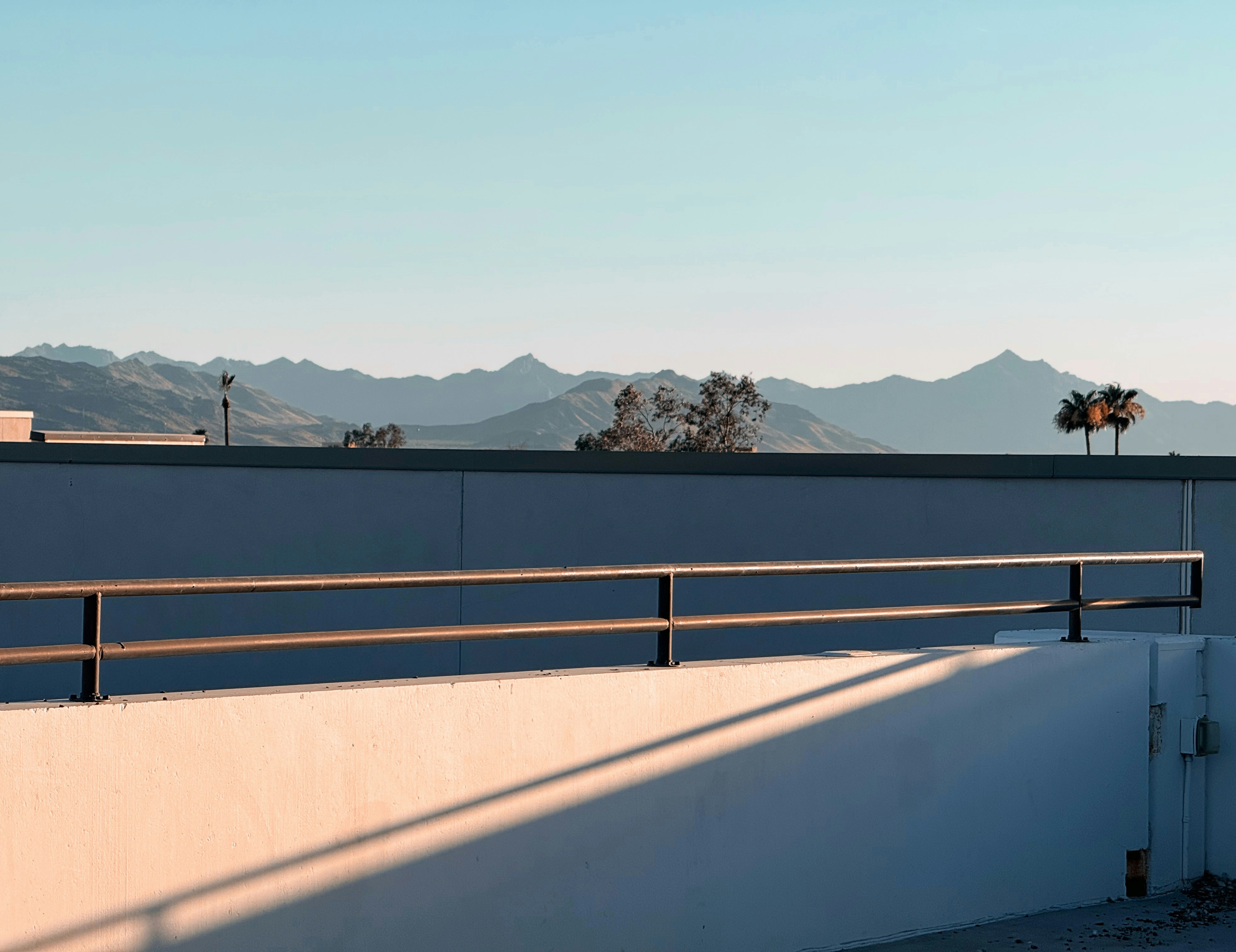 Rooftop Echoes: Distant Ridge Over a Quiet Terrace