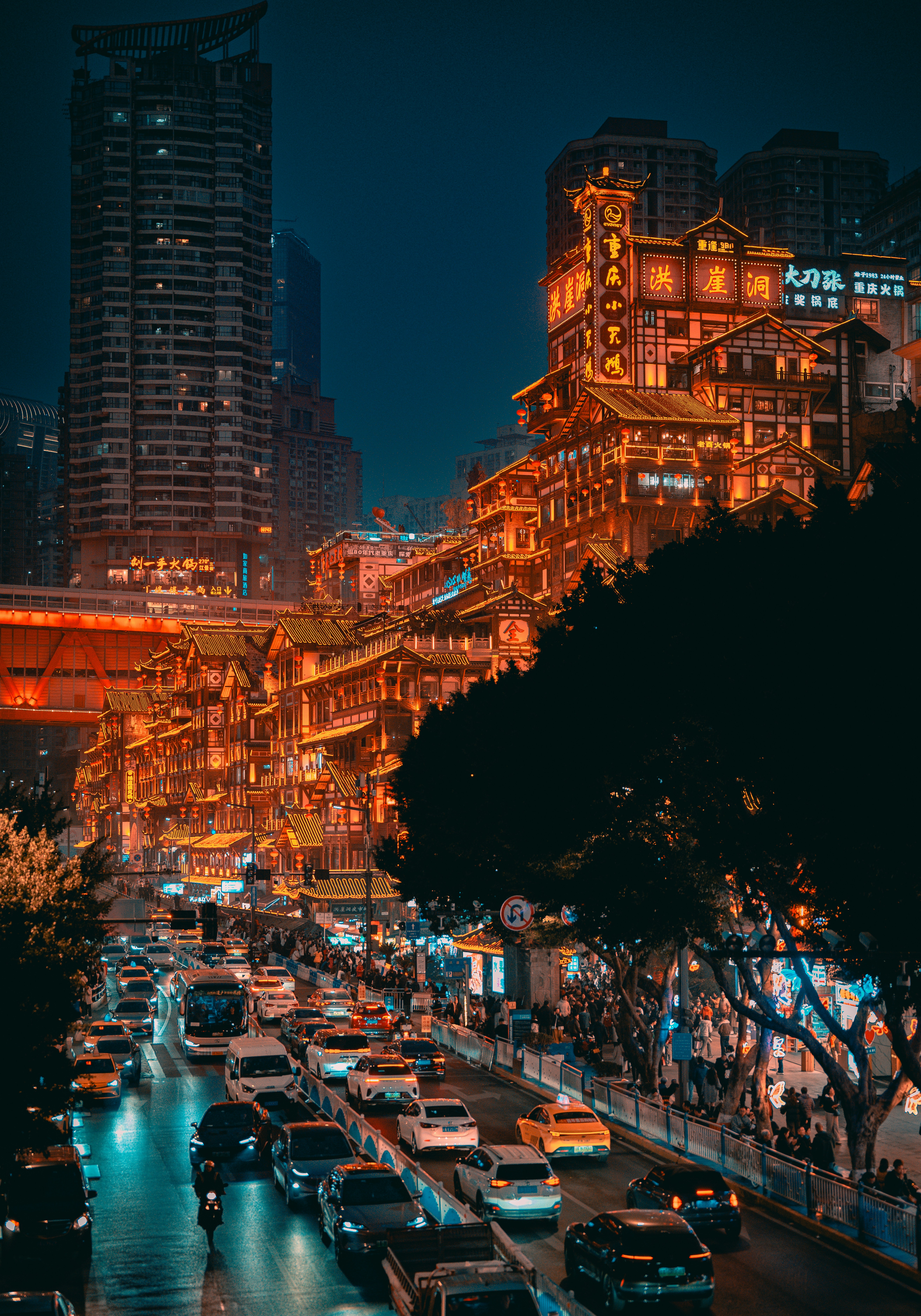 Neon Promise: Night Traffic Beneath a Lantern-Linked Skyline