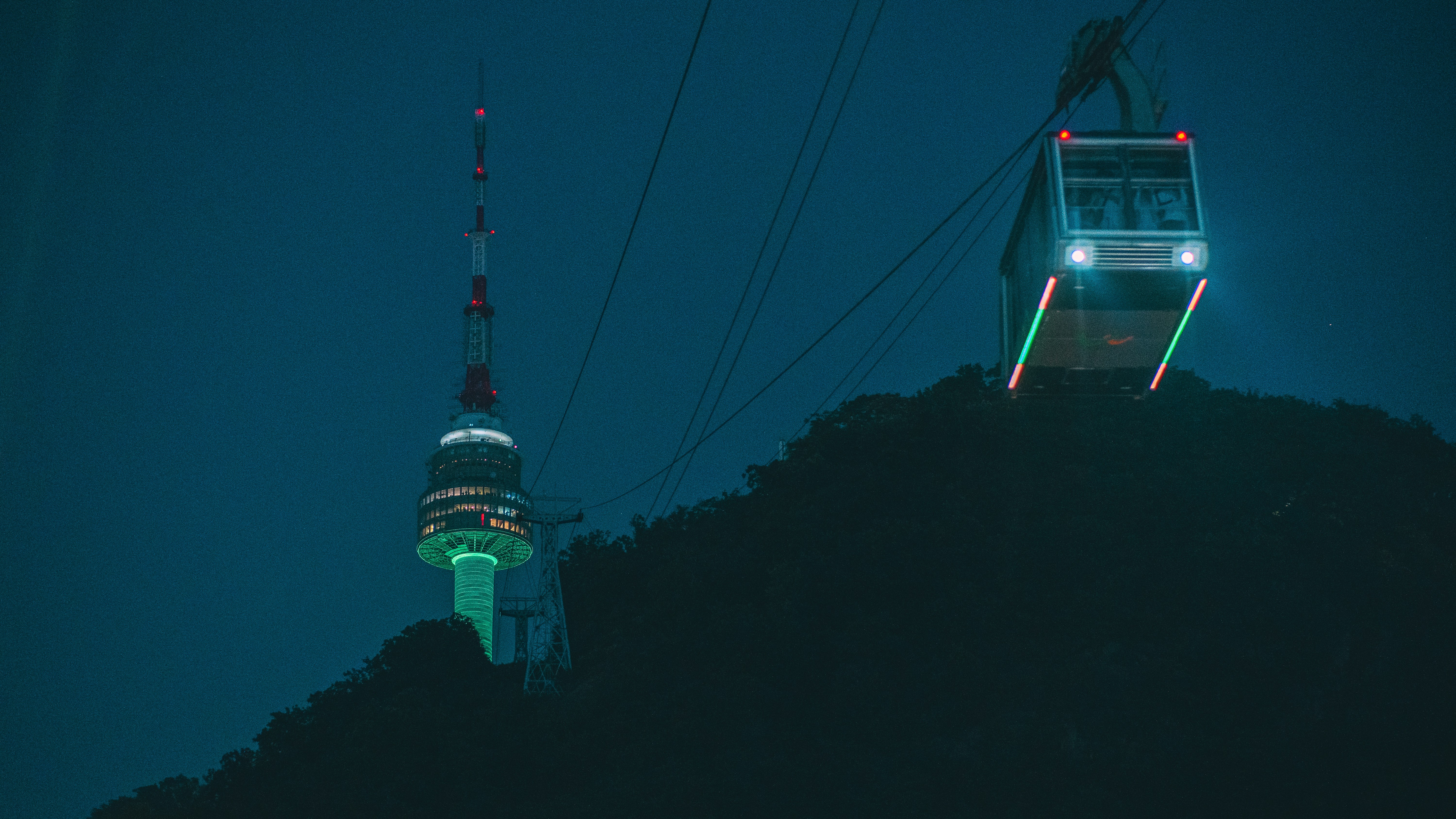 Cable Car Silhouette Over City Nightscape