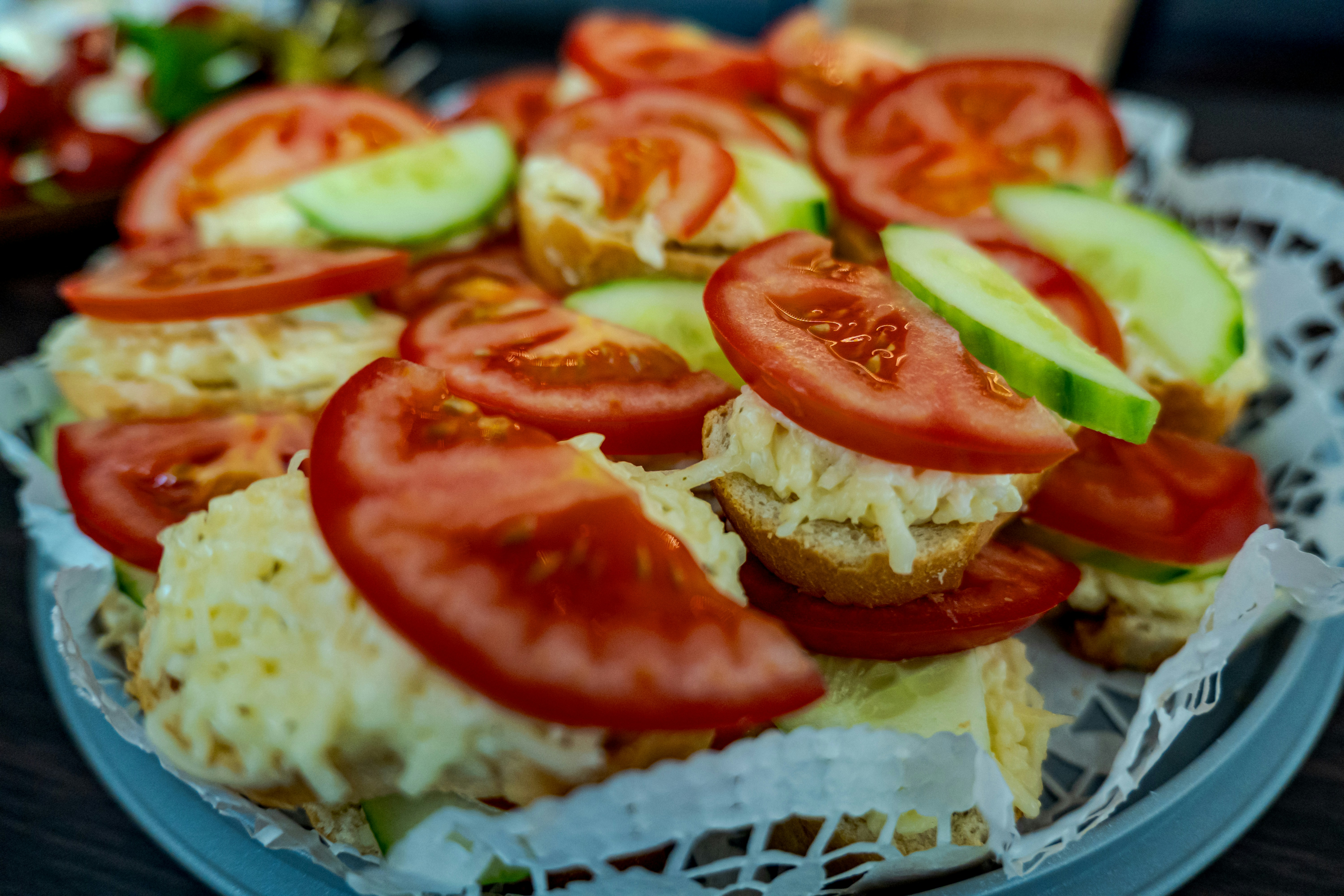 Crostini Tower: Fresh Tomato and Cucumber Garnishing on Creamy Scoop Bites