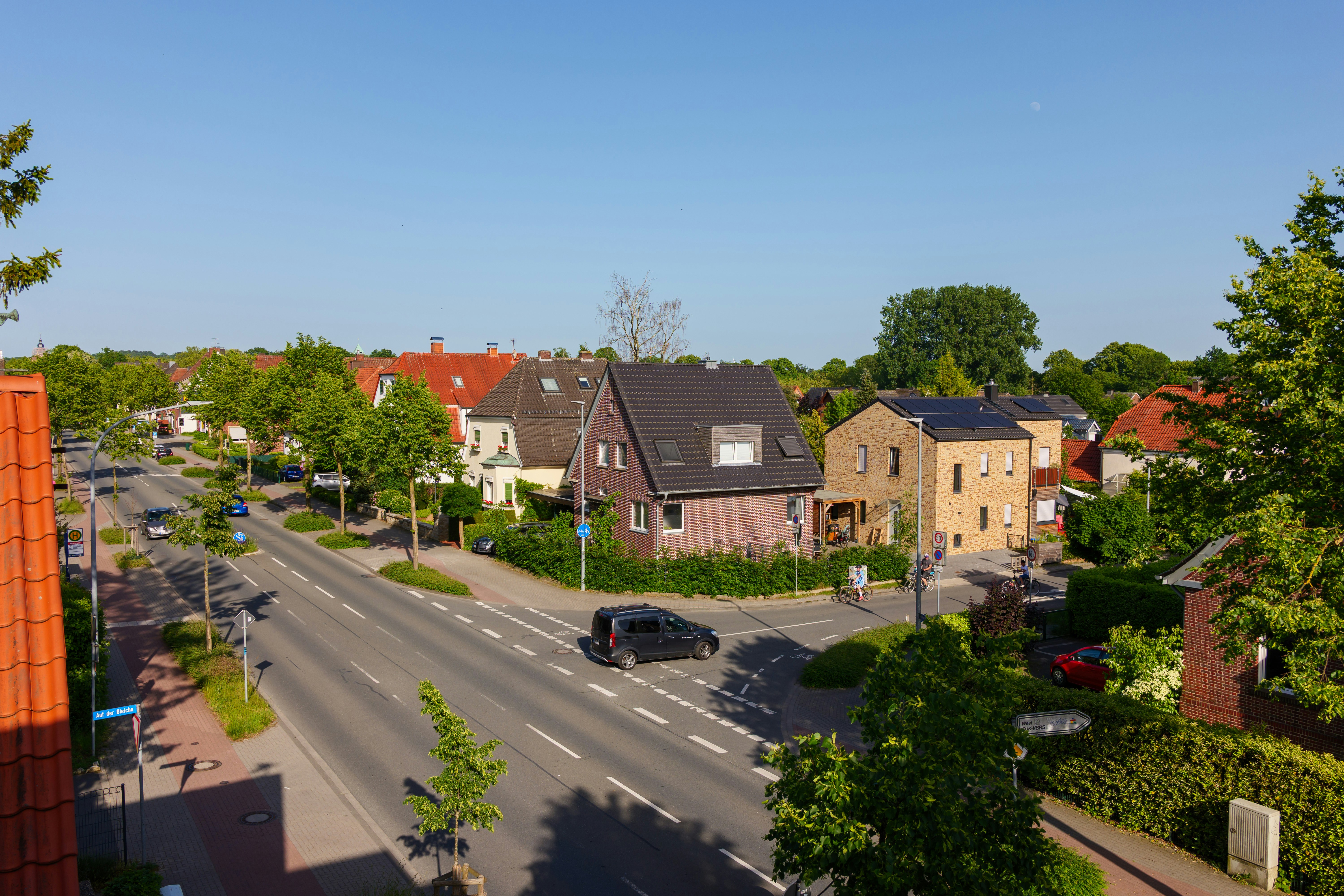 Sunlit German Streetscape with Quiet Neighborhood Corner