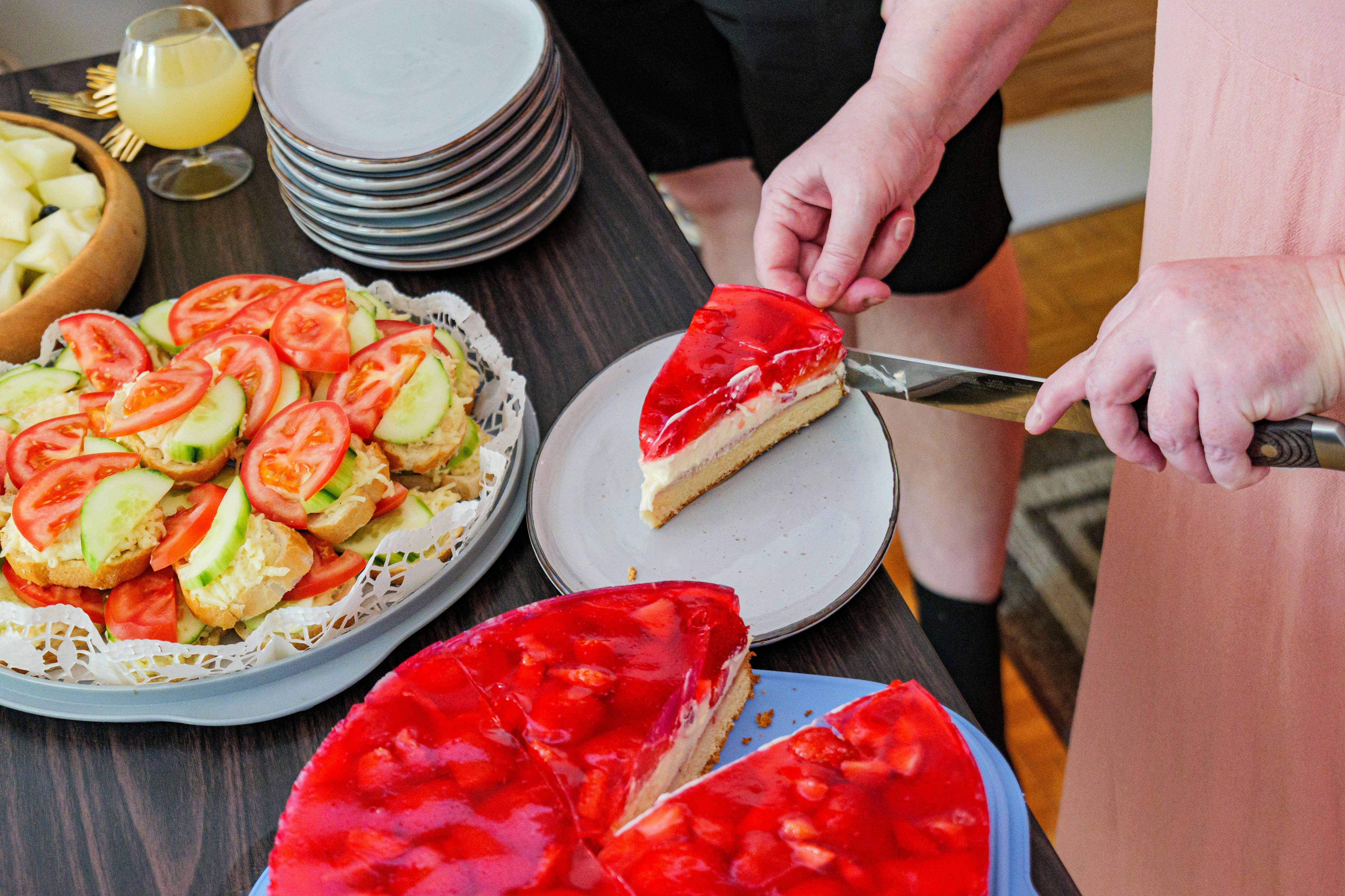 Slice of Celebration: A Red-Topped Cheesecake Moment