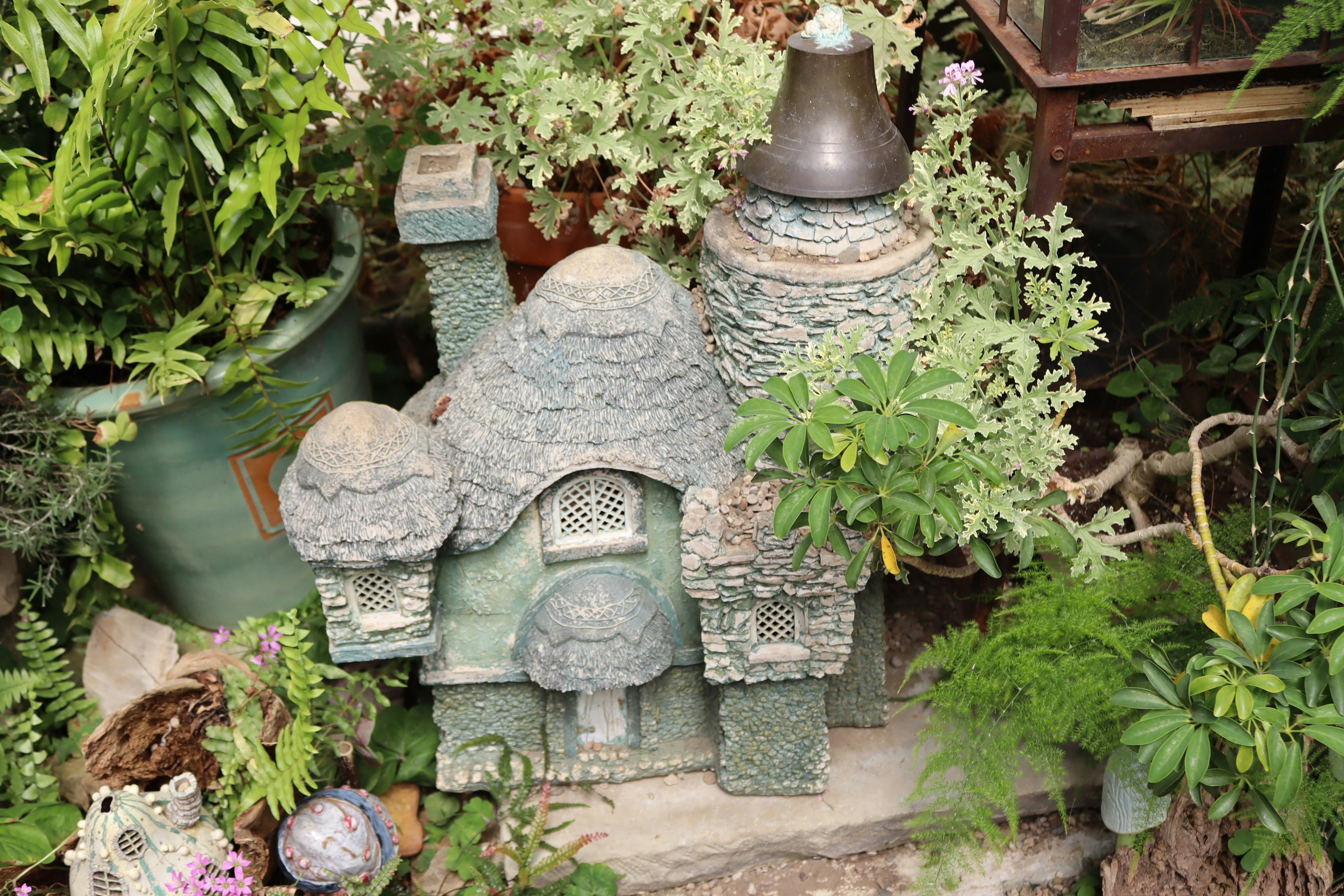 Miniature Stone Castle Nestled in a Lush Garden