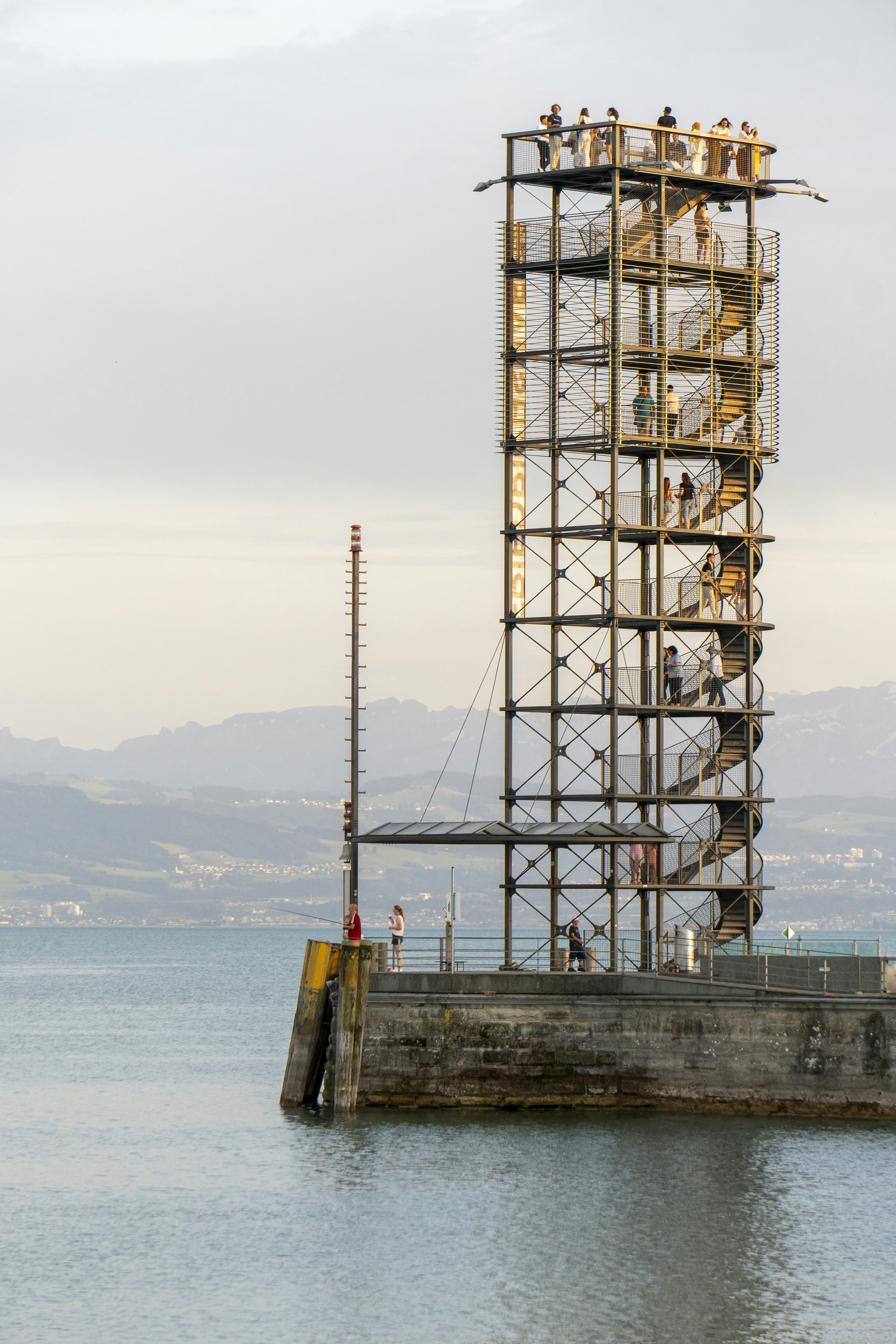 Tower of Skyhoppers: People Climb the Waterfront Structure