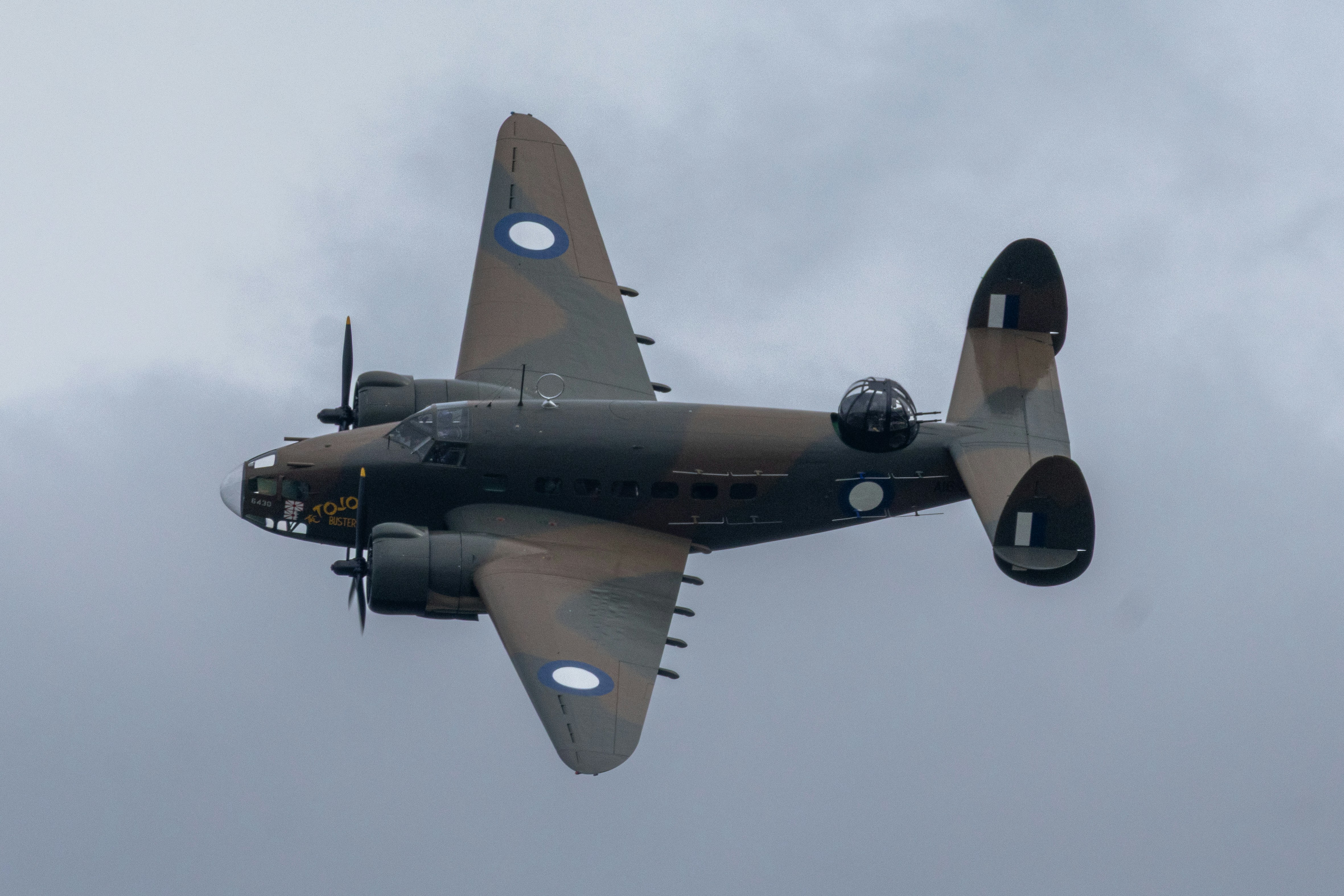 Underbelly of a vintage airframe: a mid-air silhouette