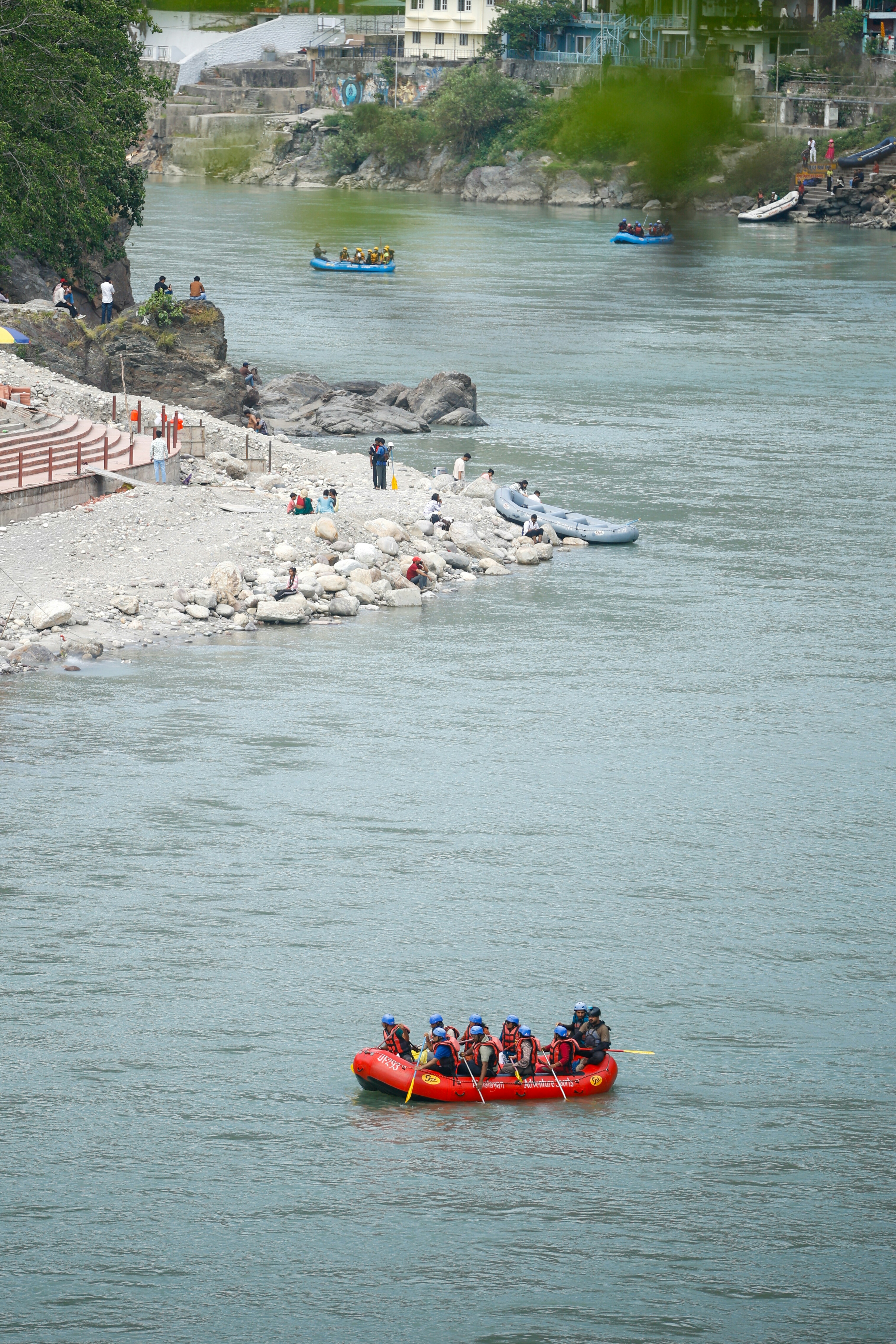 Riverbank Rendezvous: A Red Zodiac Scoops a Crew of Adventurers